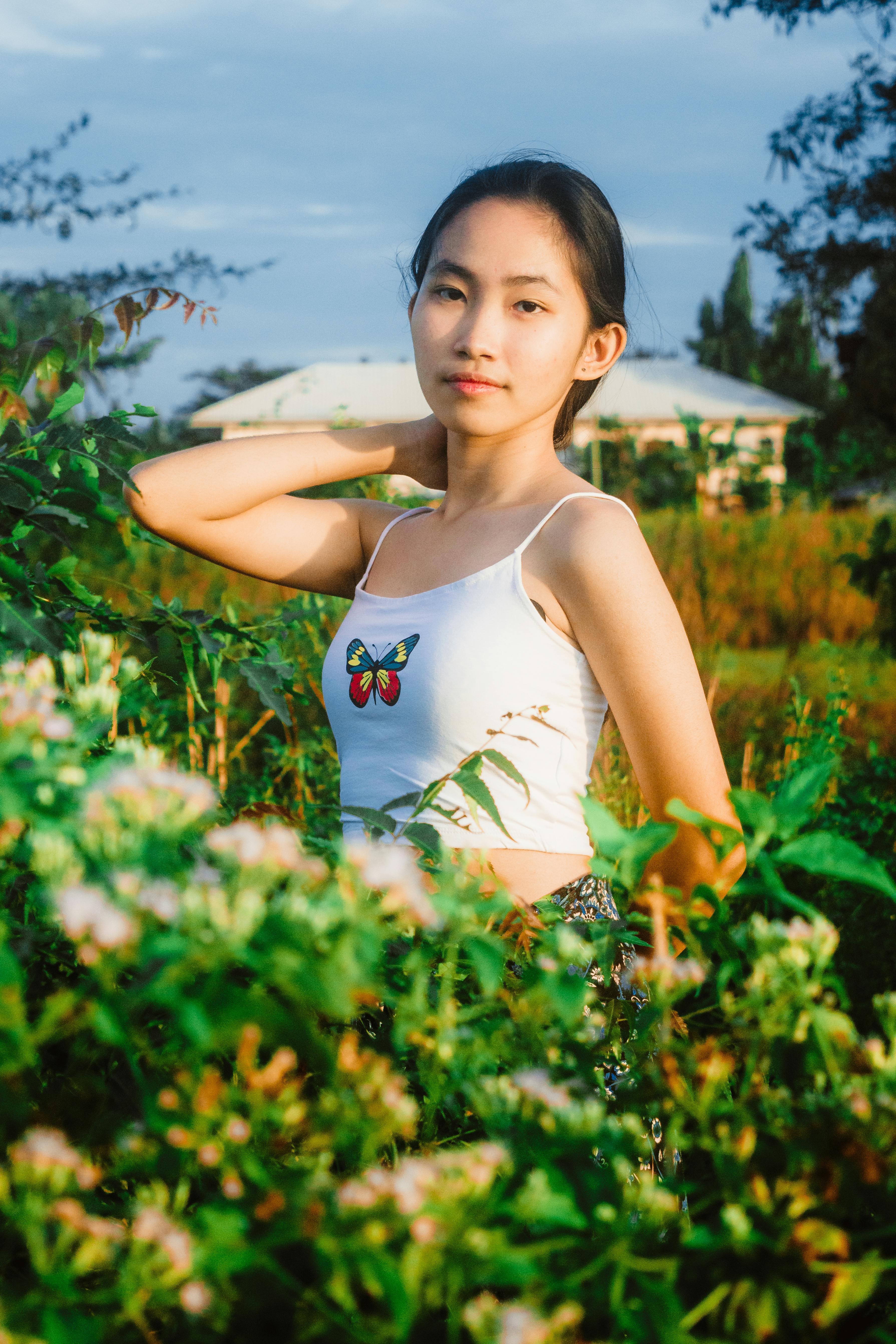 Woman Posing Wearing White Spaghetti Strap Top · Free Stock Photo
