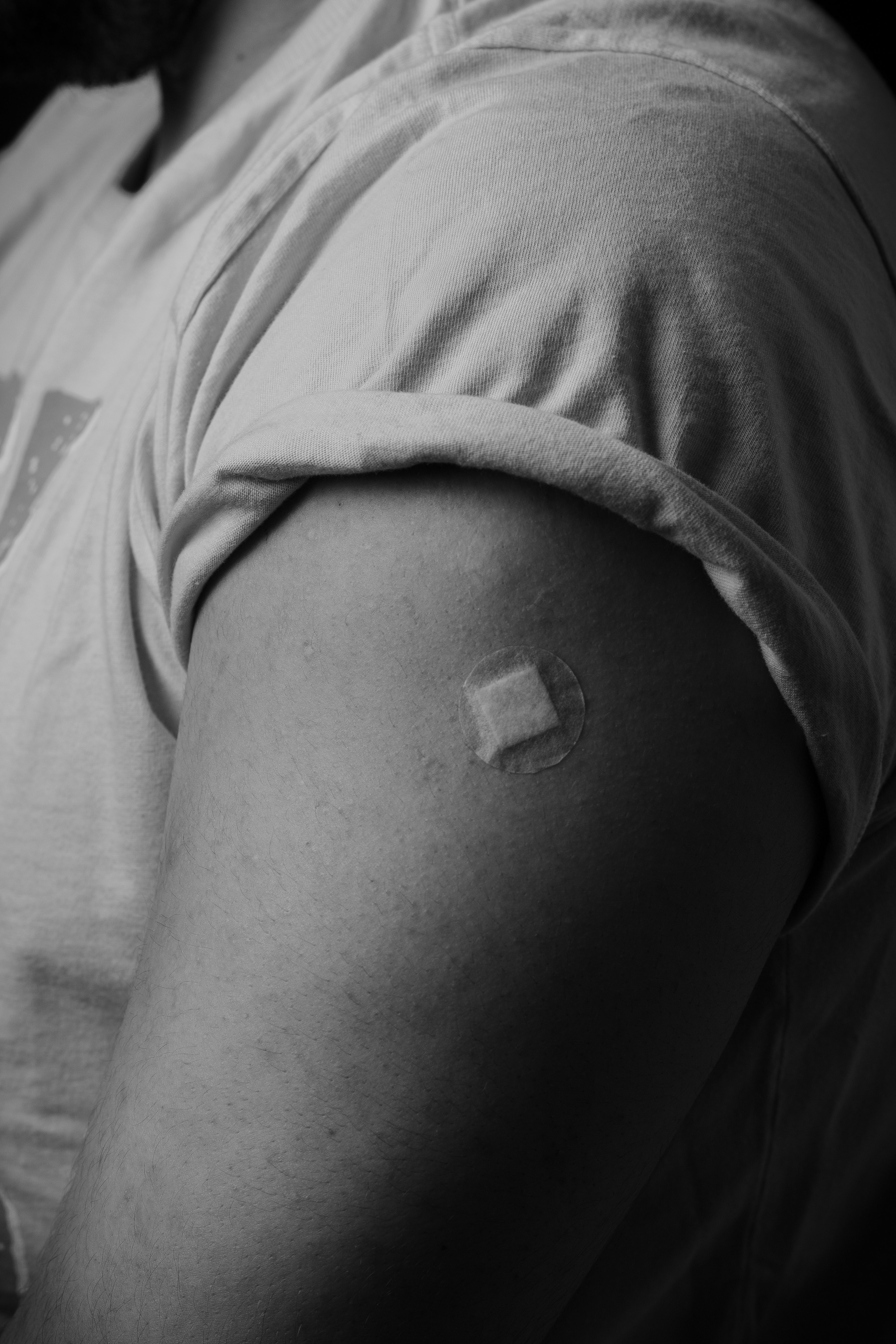 A Person with a Band Aid on the Arm · Free Stock Photo