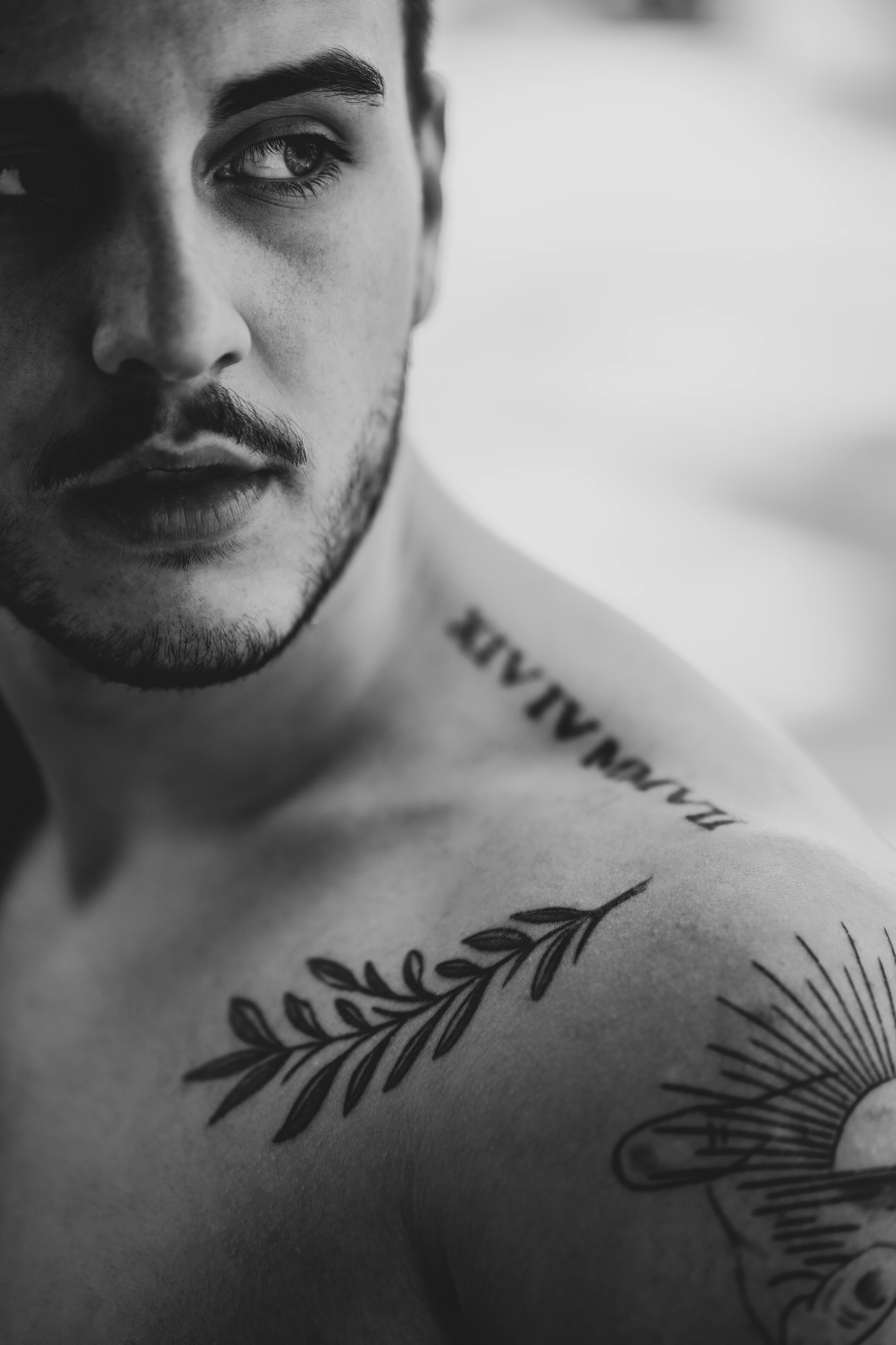 A Man with Tattoos in a Swimming Pool · Free Stock Photo