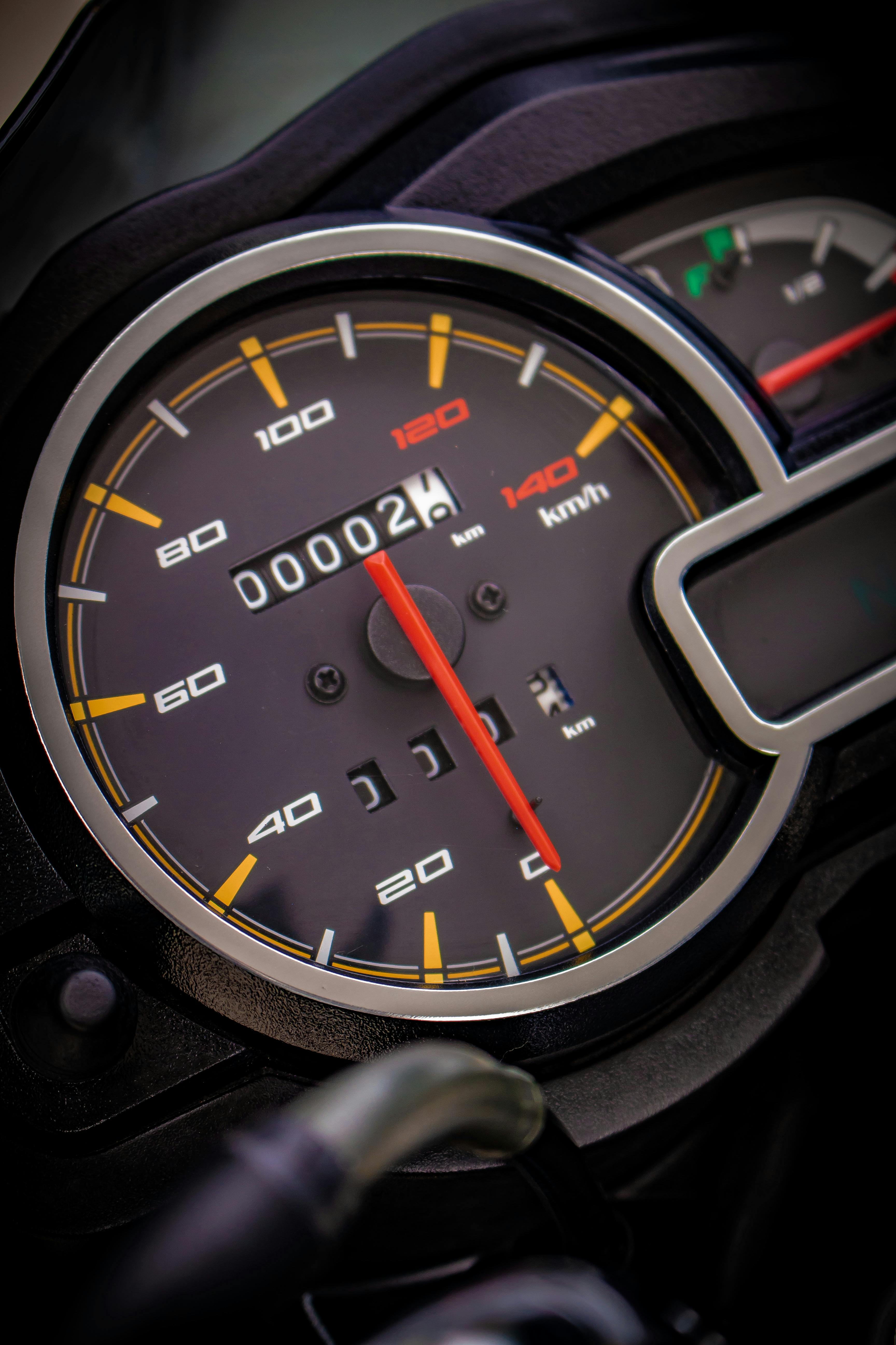 A Close-Up Shot of a Speedometer Gauge · Free Stock Photo