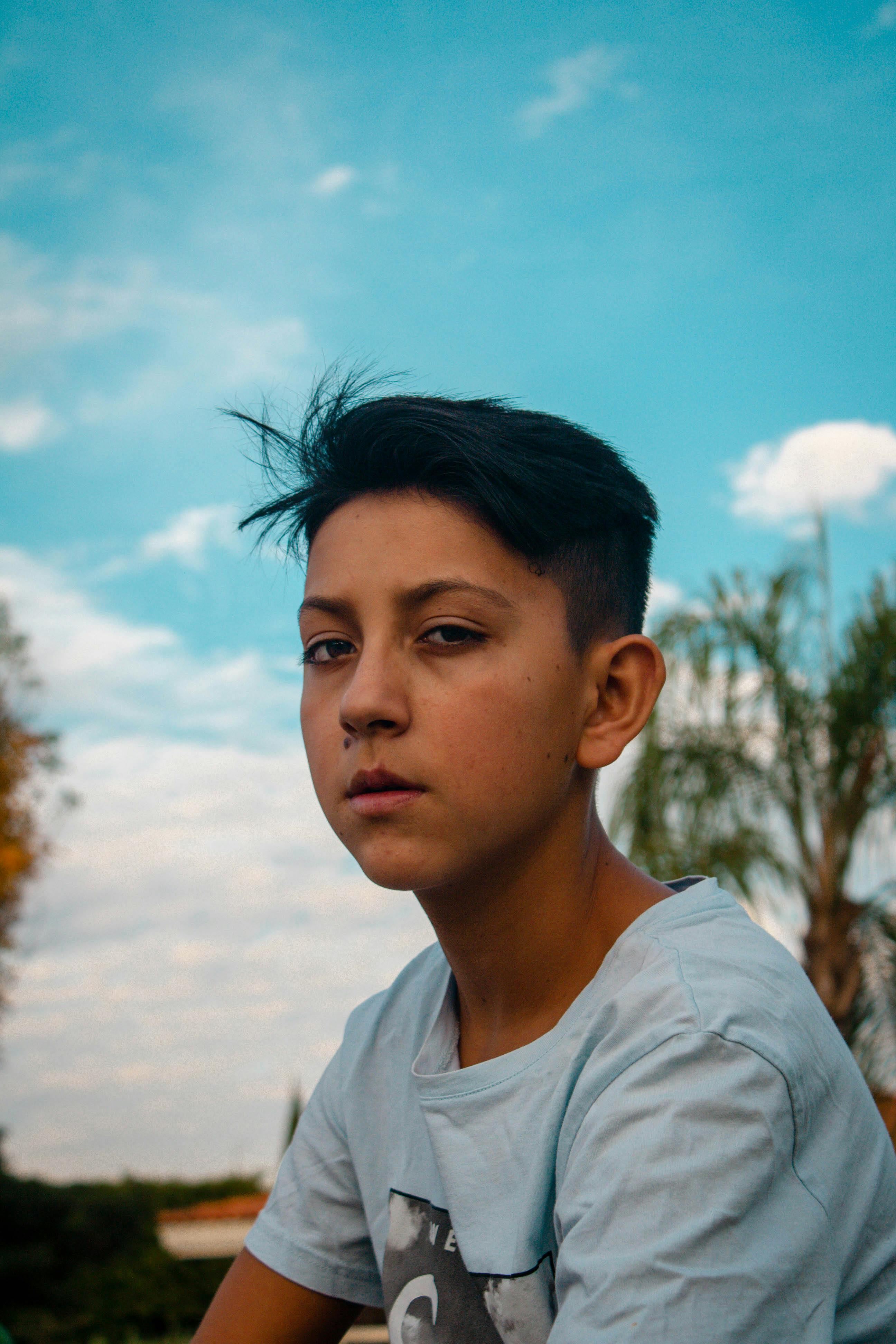 Portrait Shot of a Boy Wearing Blue Shirt · Free Stock Photo