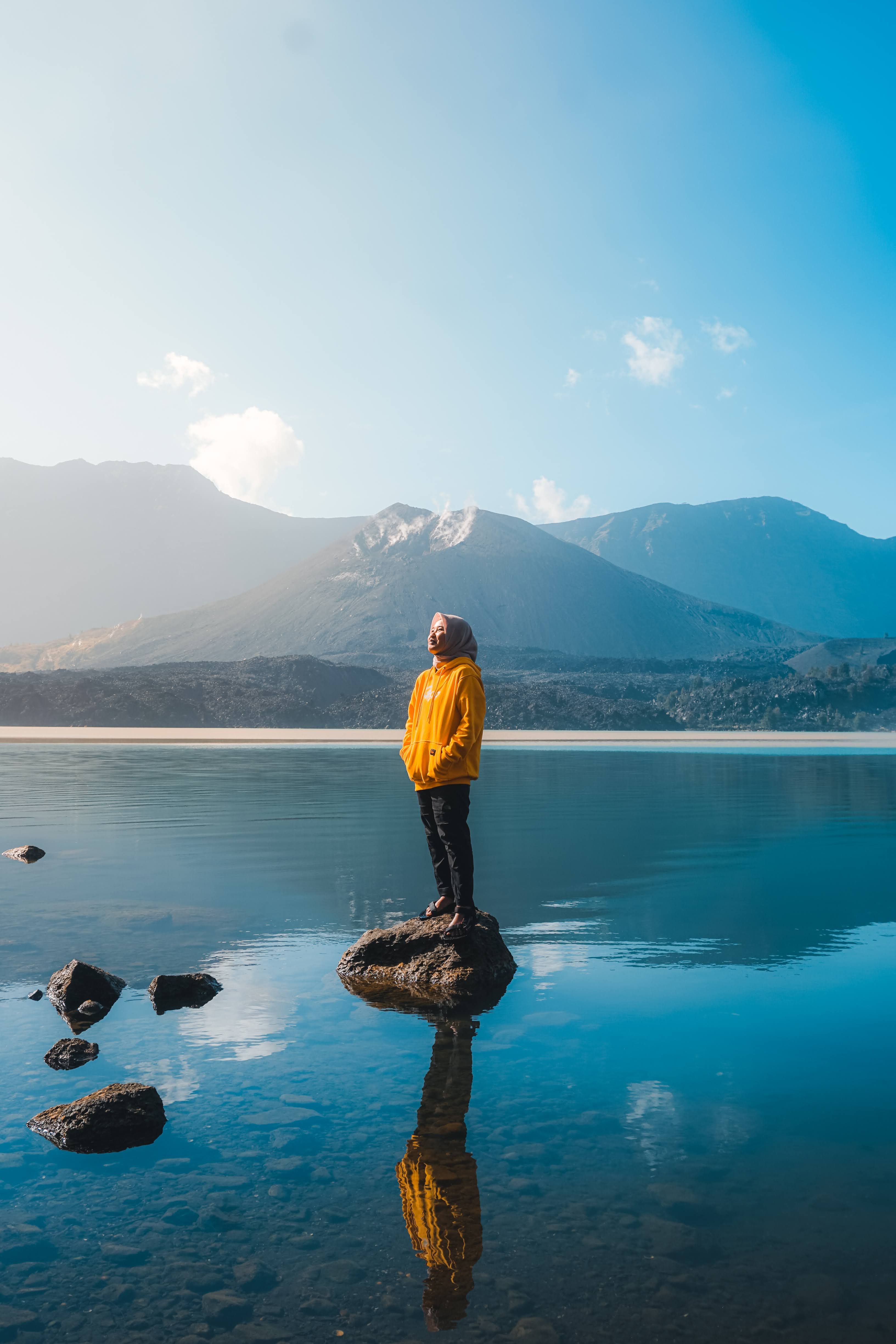 A Person Standing on a Rock · Free Stock Photo