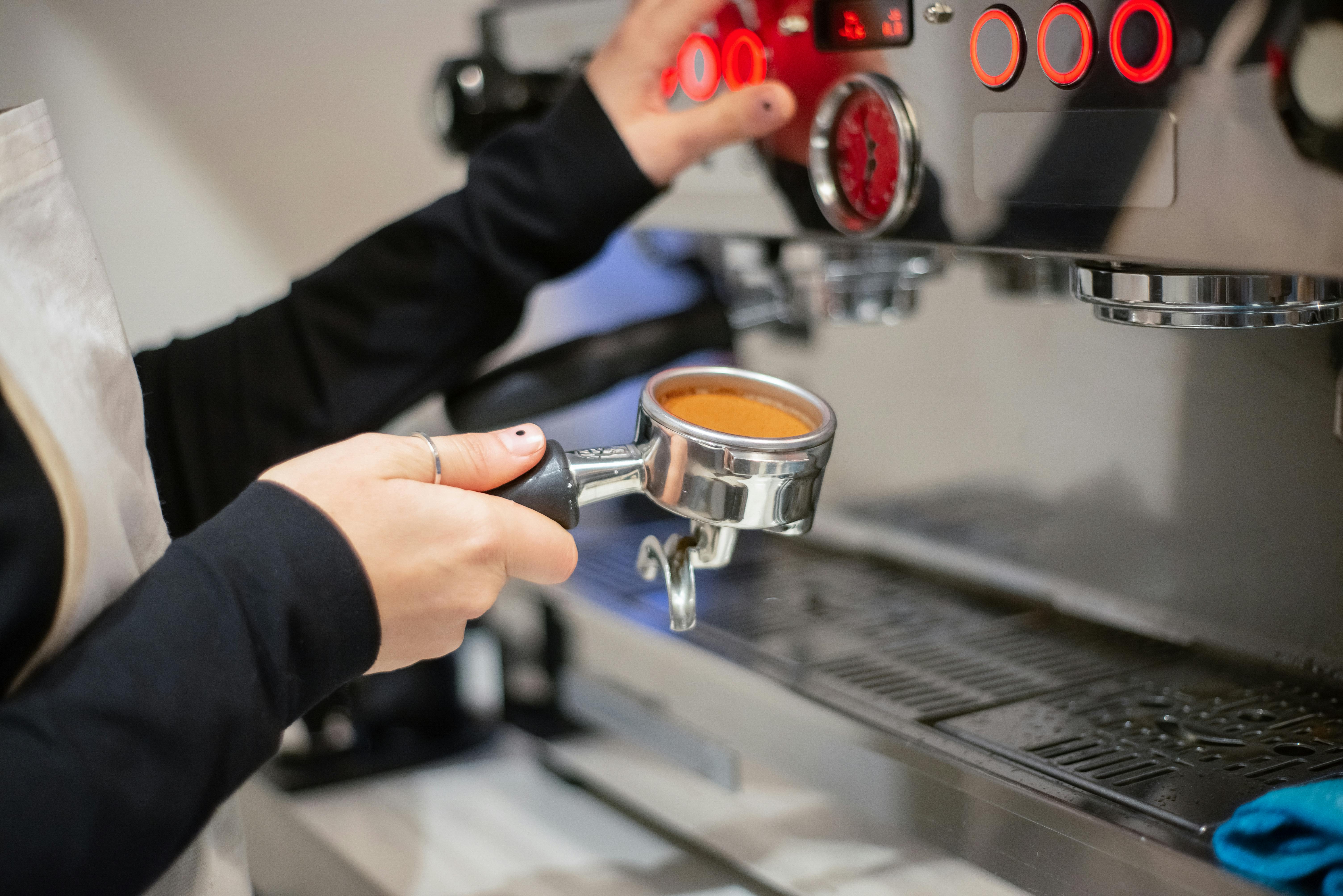 Person Using Espresso Machine · Free Stock Photo