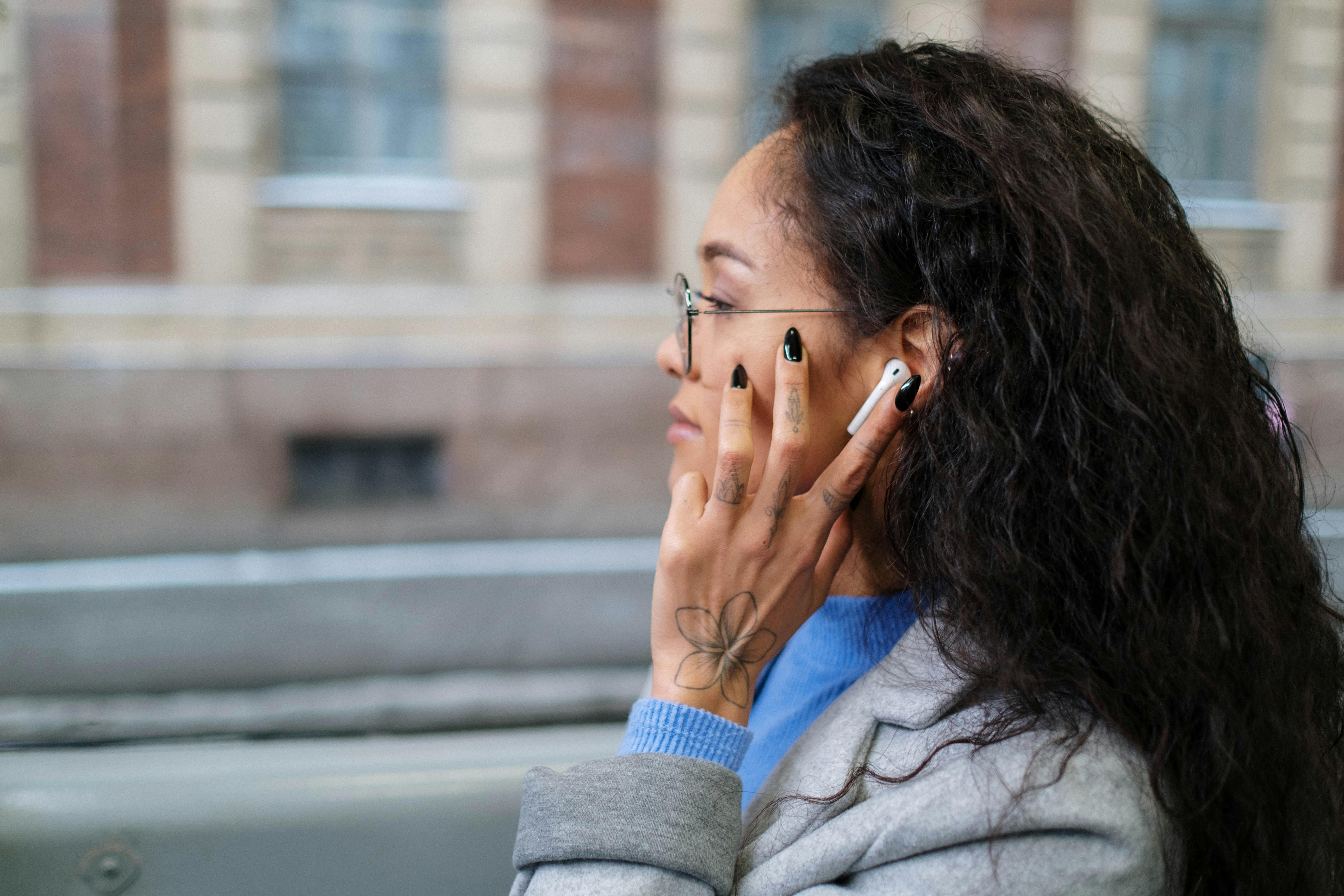 A Woman Wearing White Earpods · Free Stock Photo