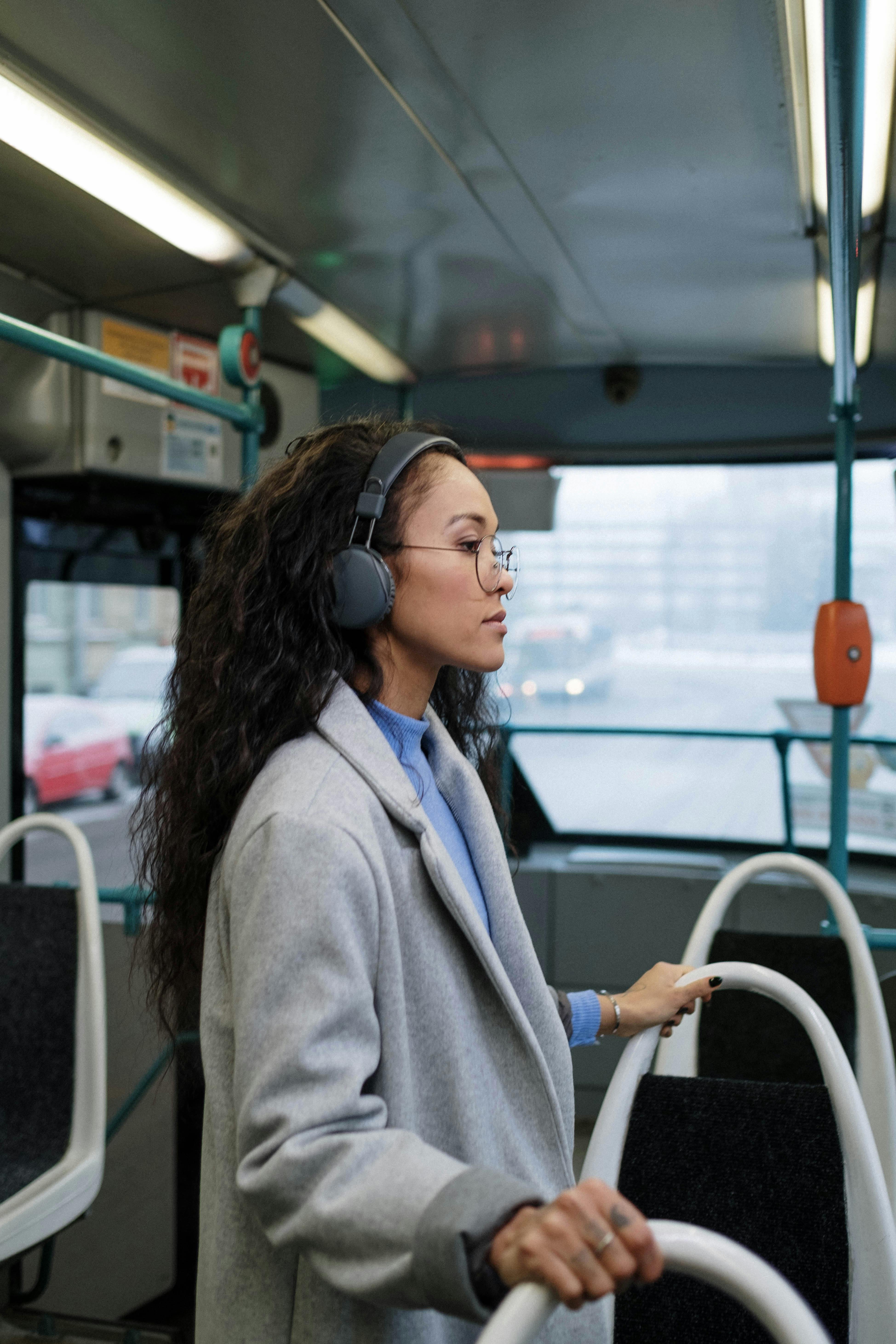 Woman Standing Inside a Bus · Free Stock Photo