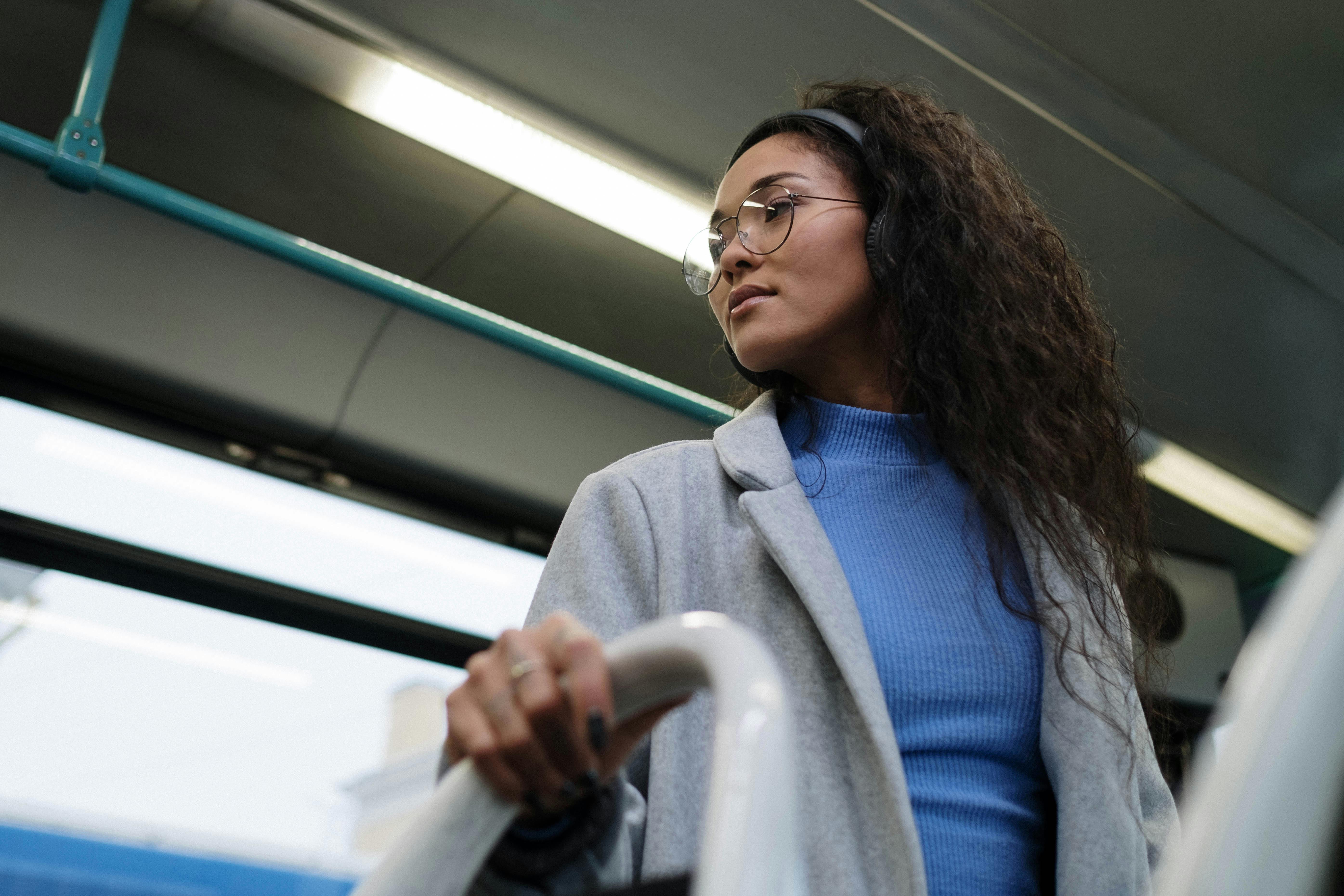 Woman Standing Inside a Bus · Free Stock Photo