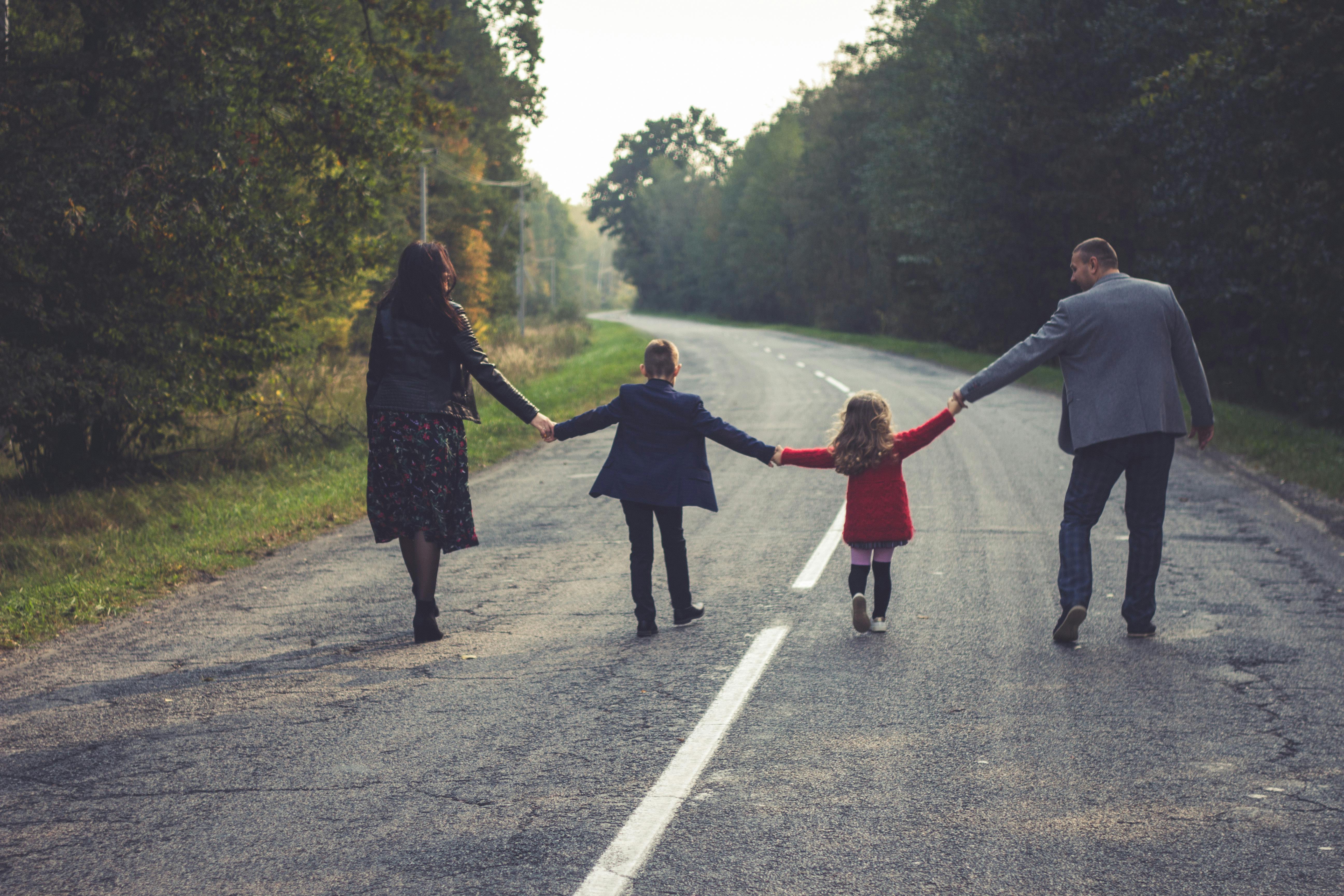 Back View of a Family Walking on the Road · Free Stock Photo