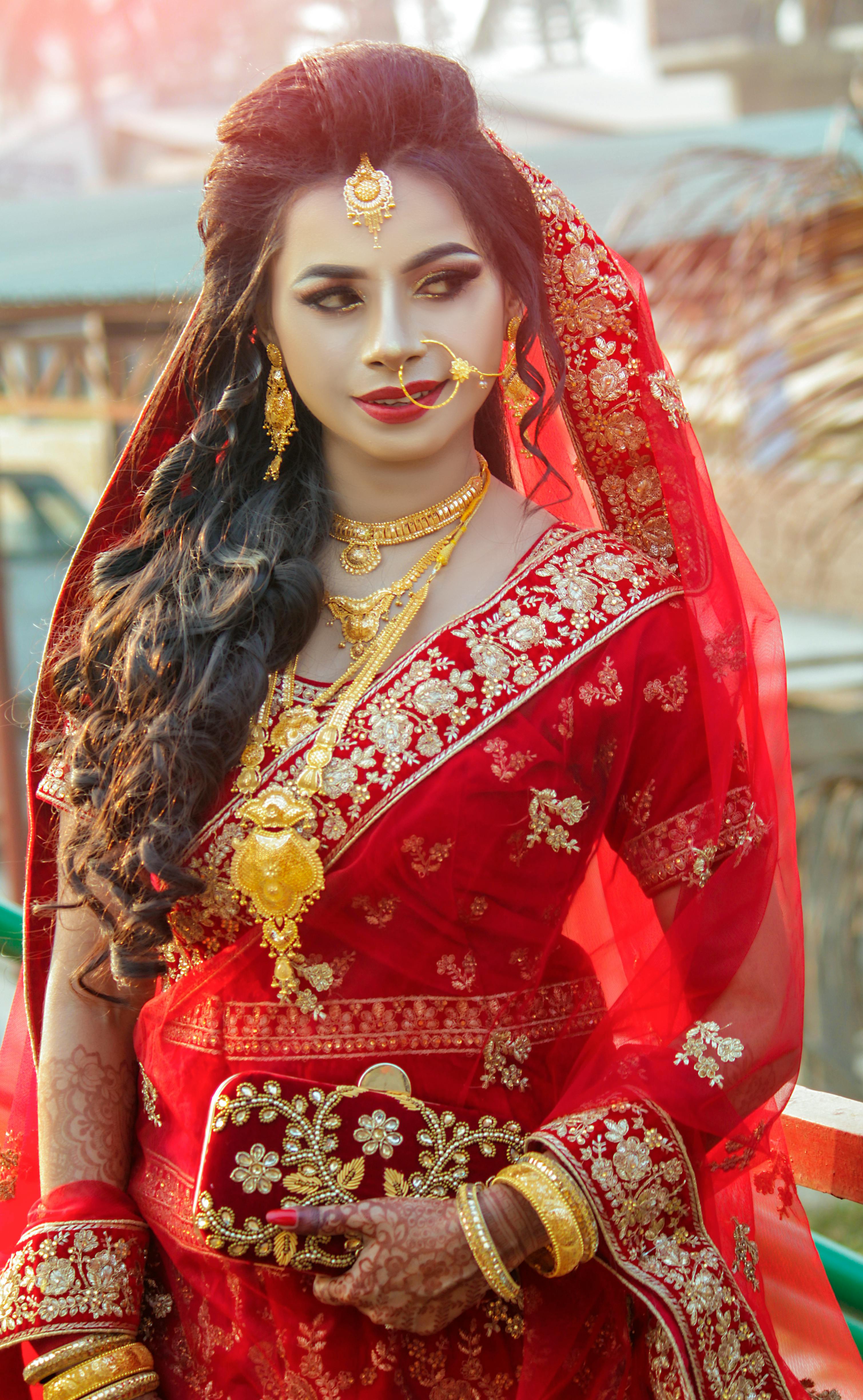 A Beautiful Woman Wearing Red Traditional Lehenga · Free Stock Photo