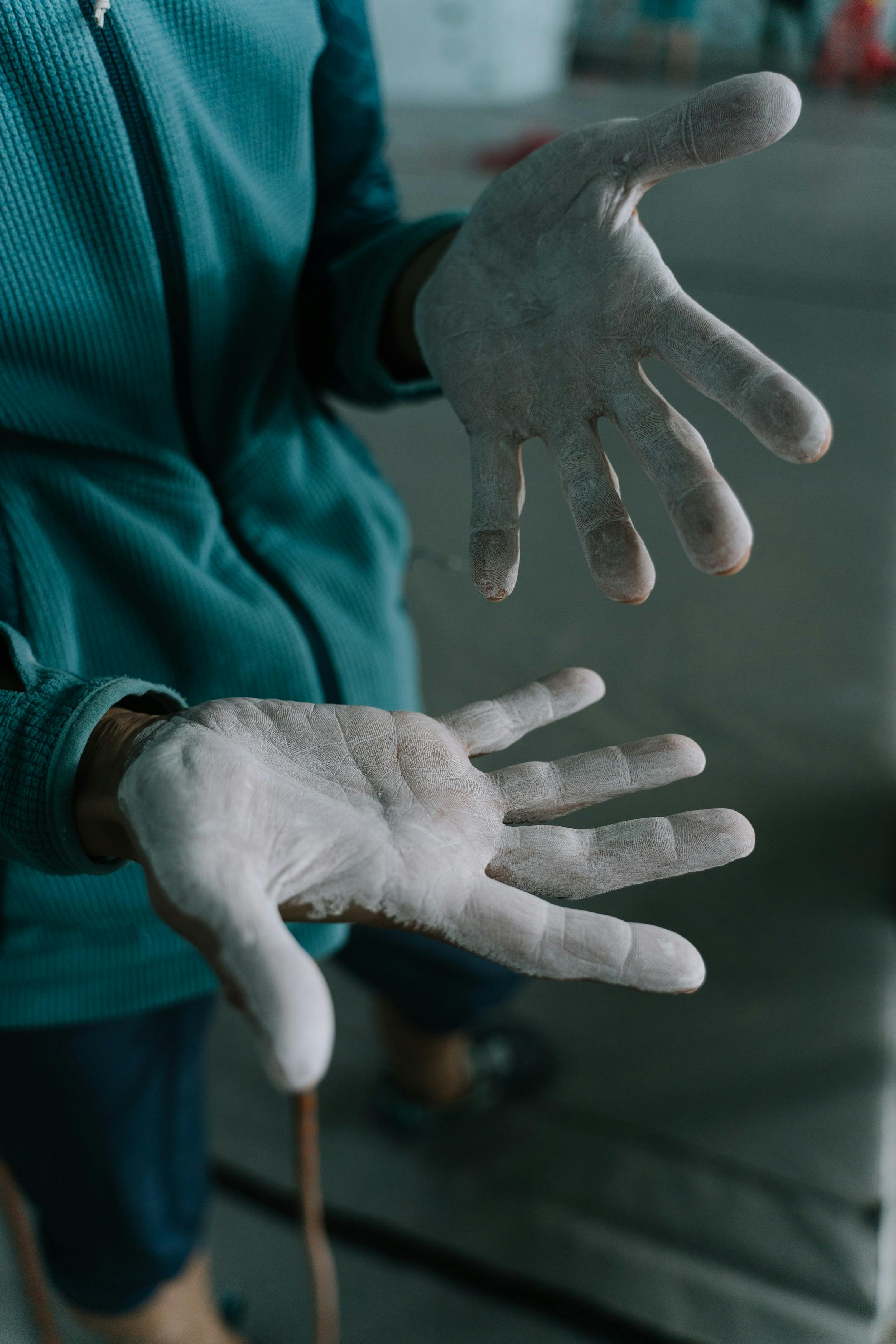 Close-up of Person with Talc on Hands · Free Stock Photo
