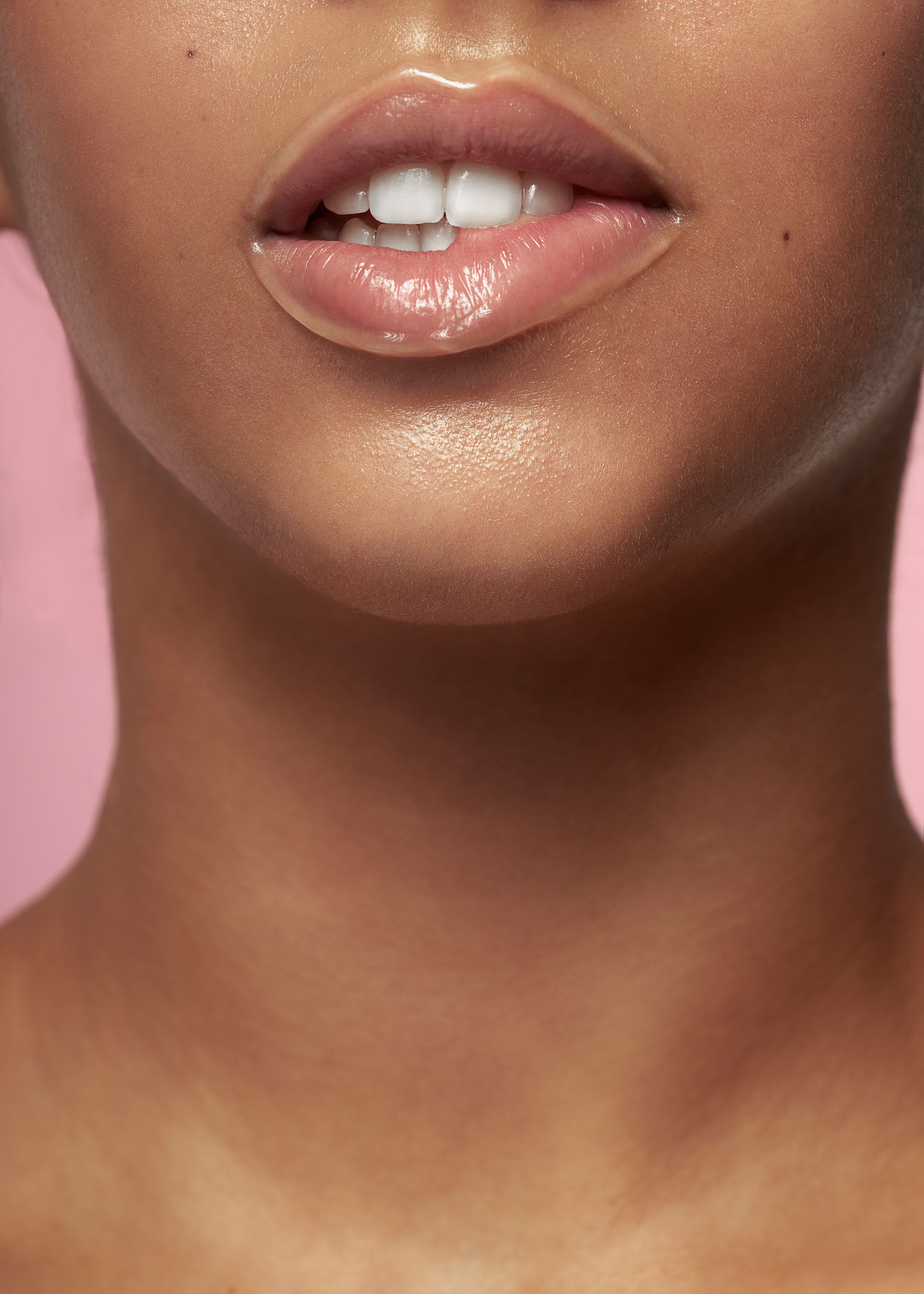 Close Up Photo Of A Woman Biting Her Lips · Free Stock Photo
