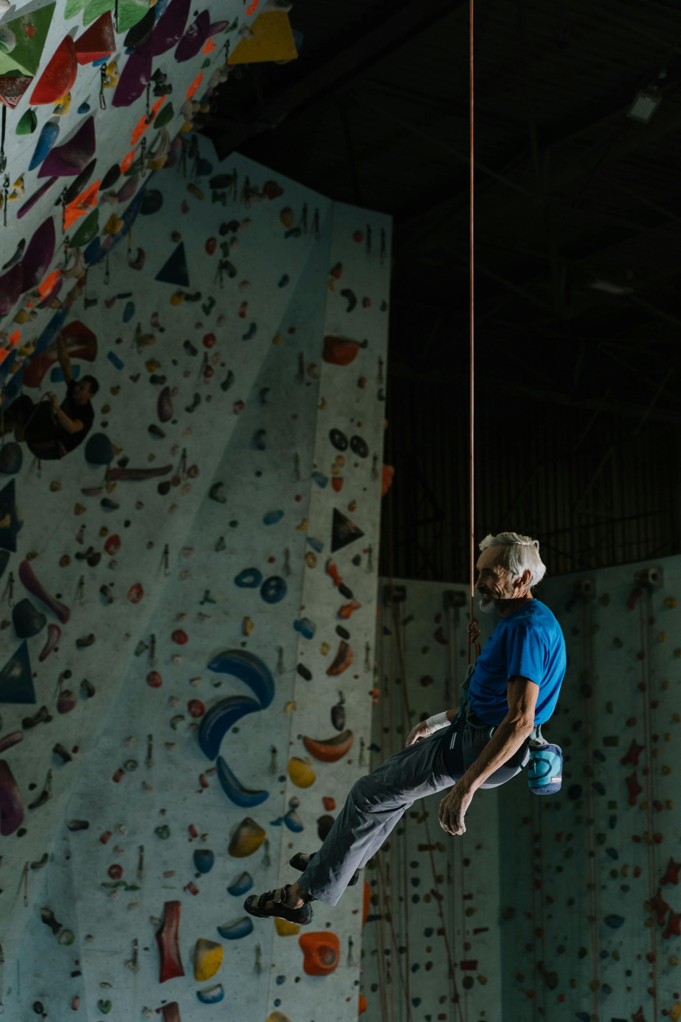 An Elderly Man Hanging from a Harness · Free Stock Photo