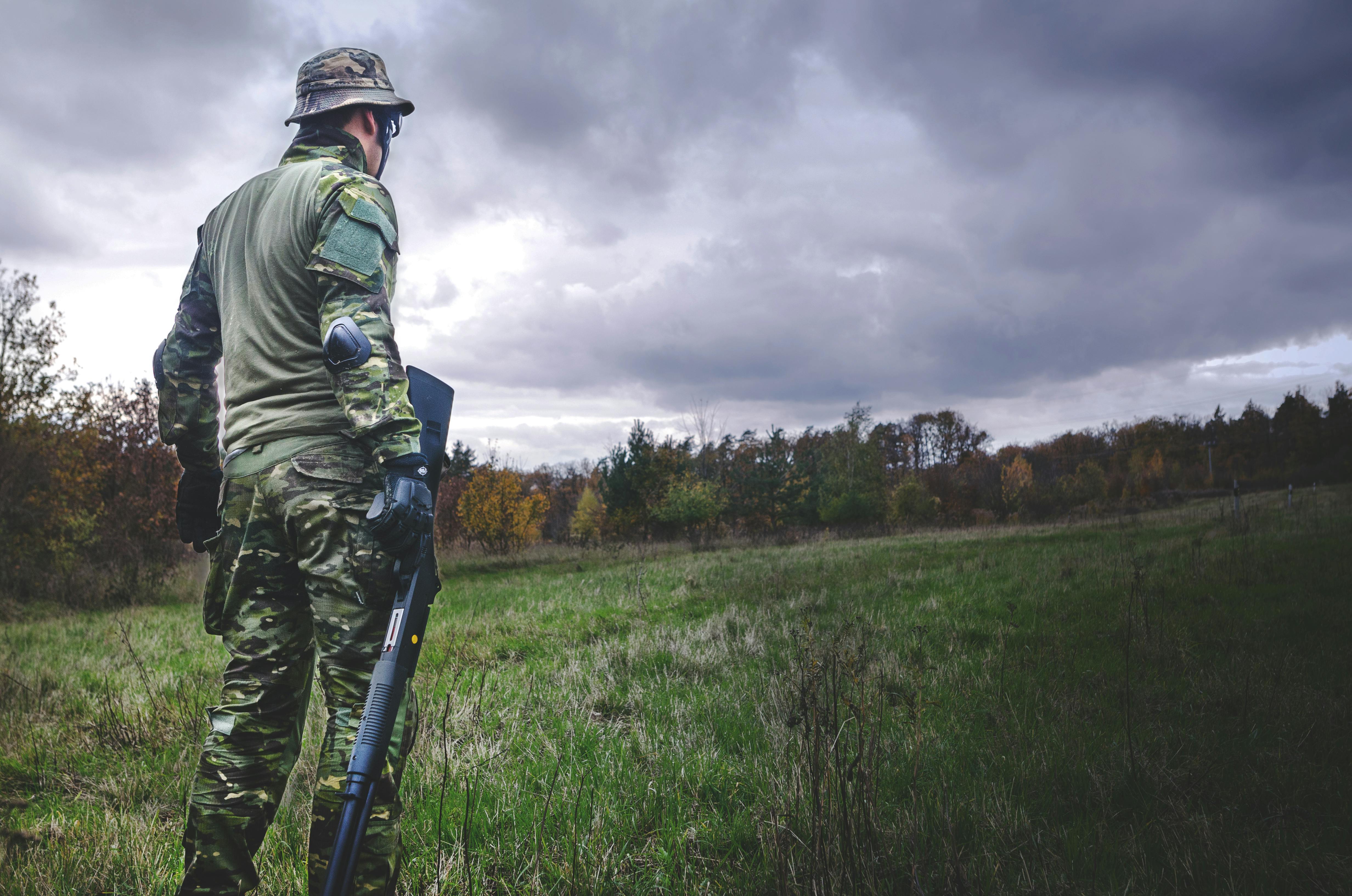 Man in Camouflage Soldier Suit While Holding Black Hunting Rifle · Free ...