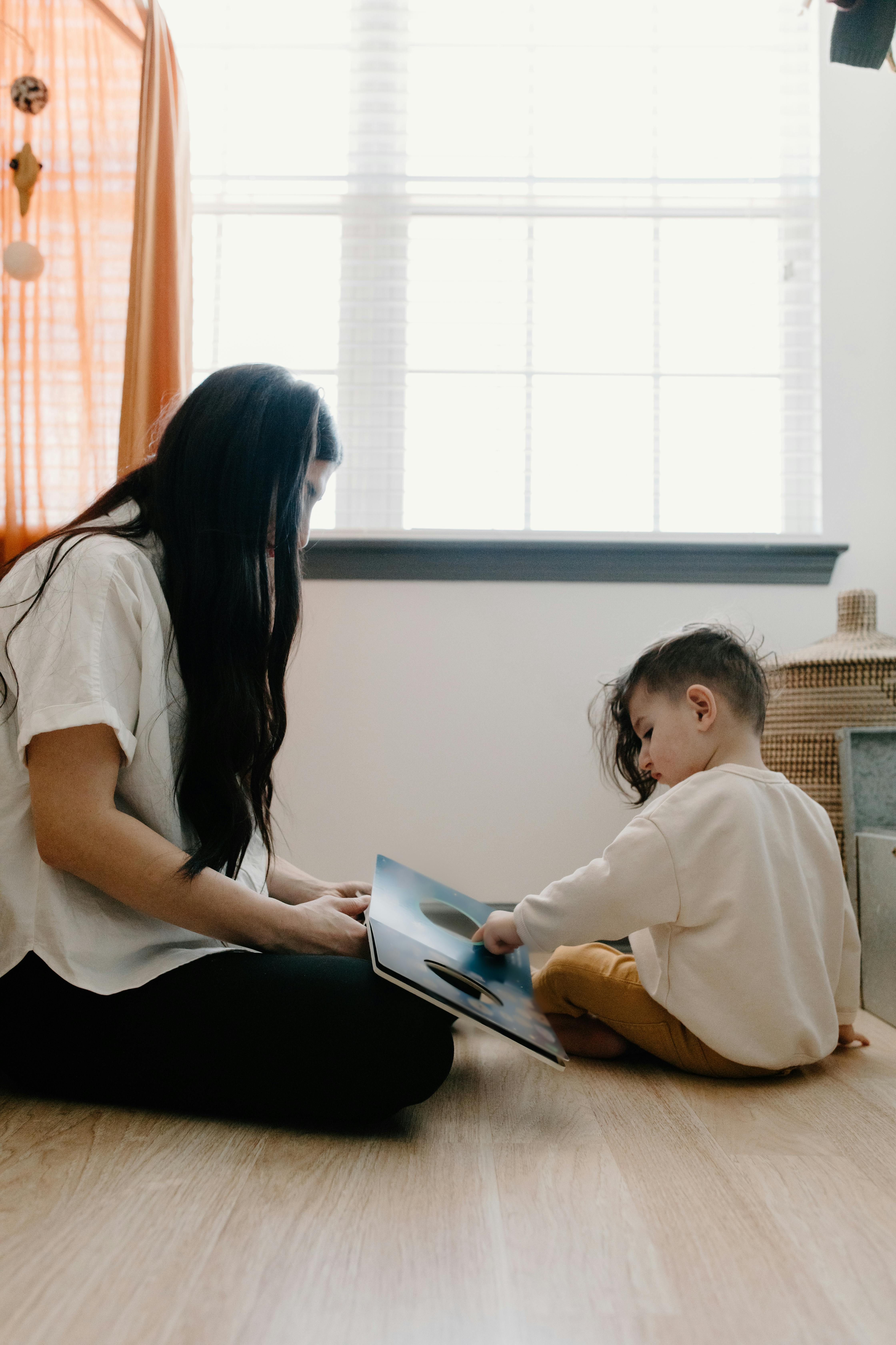 Mother and Child Sitting on the Floor · Free Stock Photo