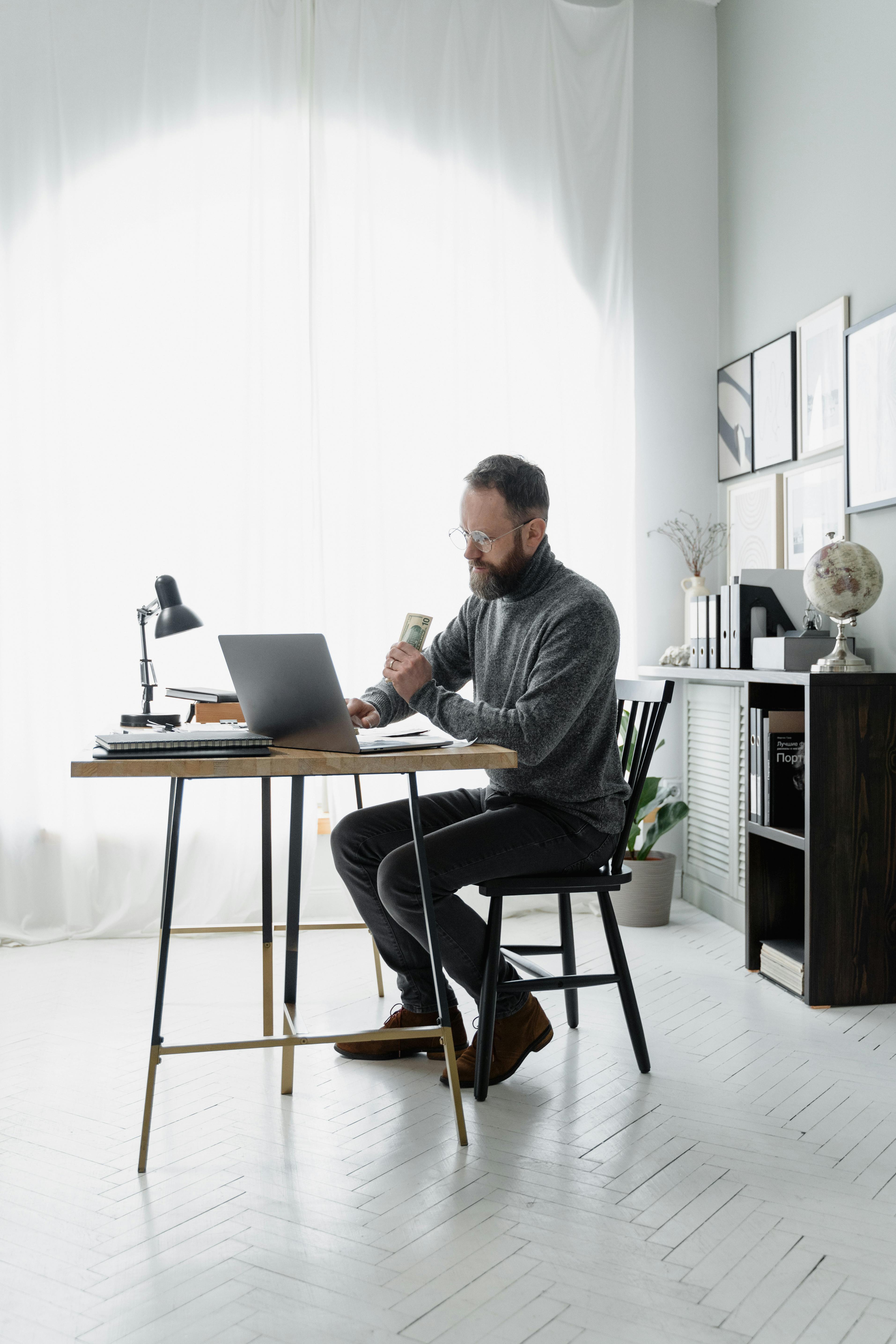 Man Sitting at his Desk · Free Stock Photo