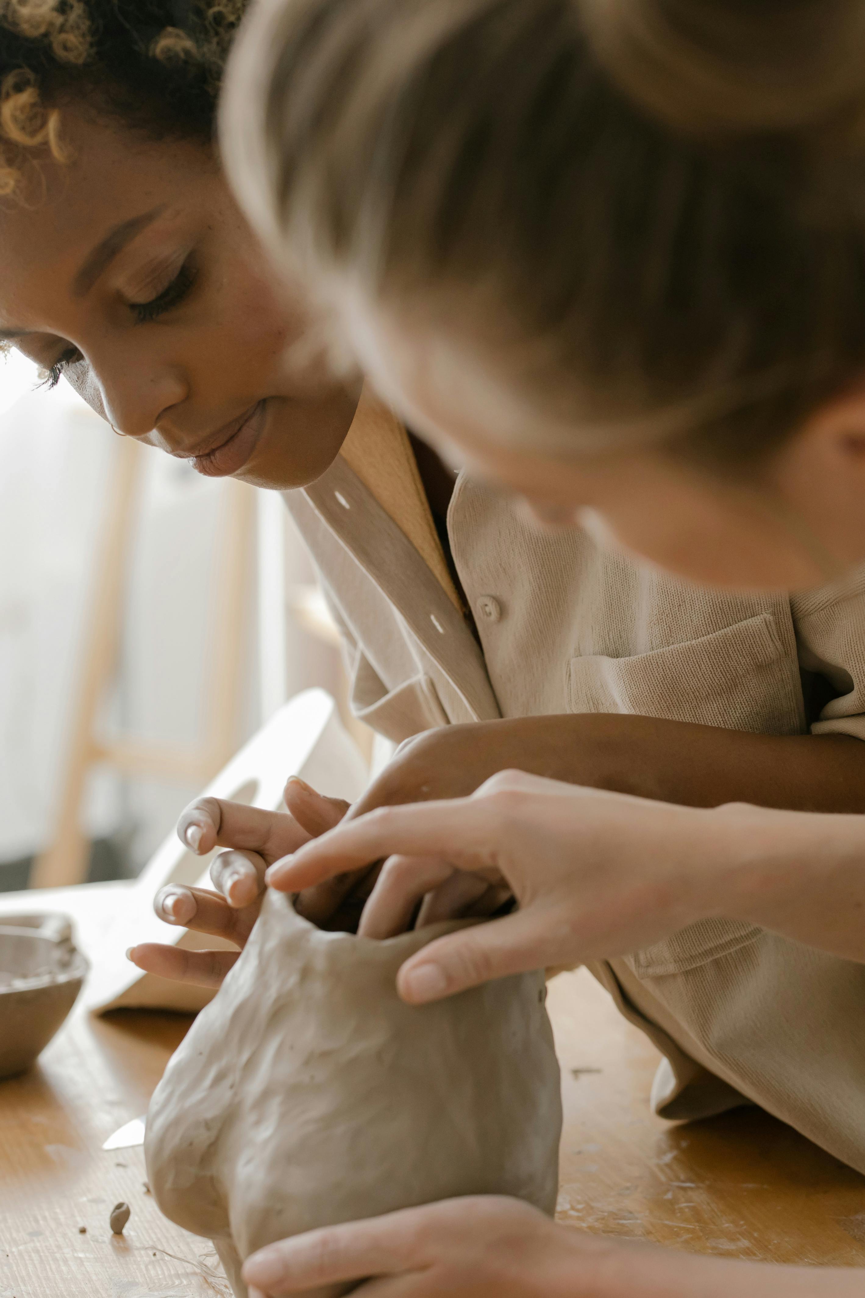 Two Women Making a Sculpture · Free Stock Photo