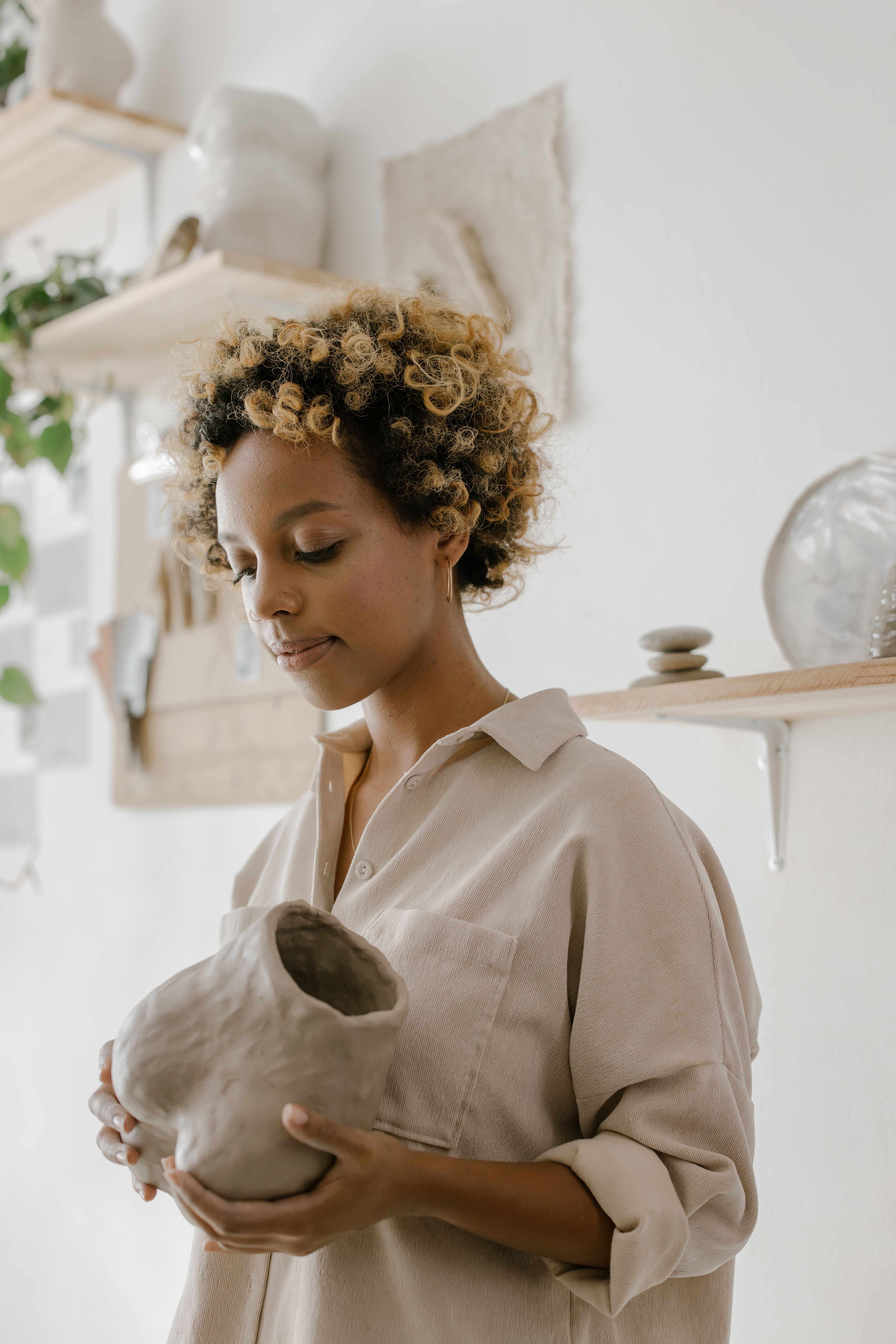 Woman in Beige Top Holding a Beige Clay Pot · Free Stock Photo