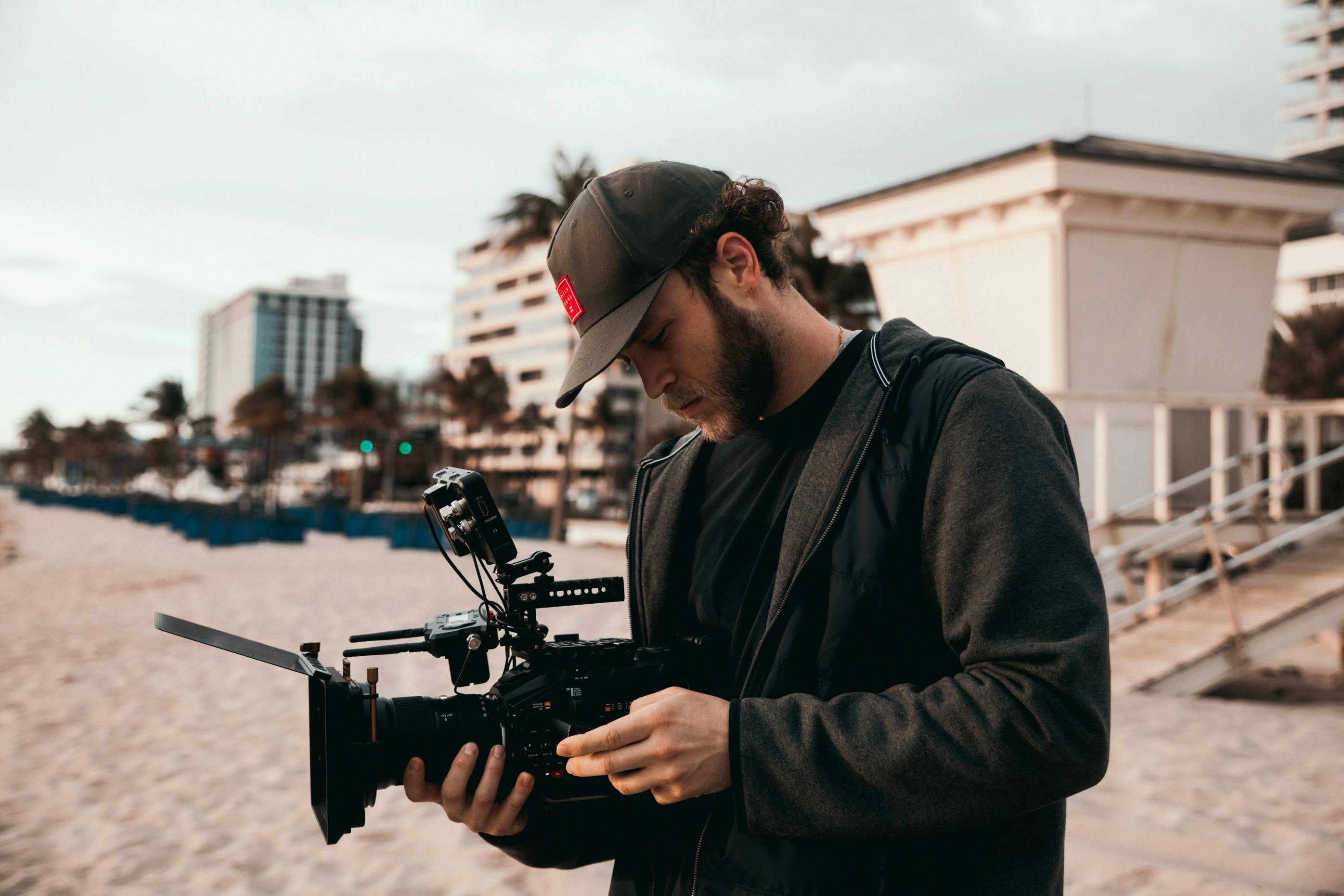 A Cameraman Taking Video · Free Stock Photo