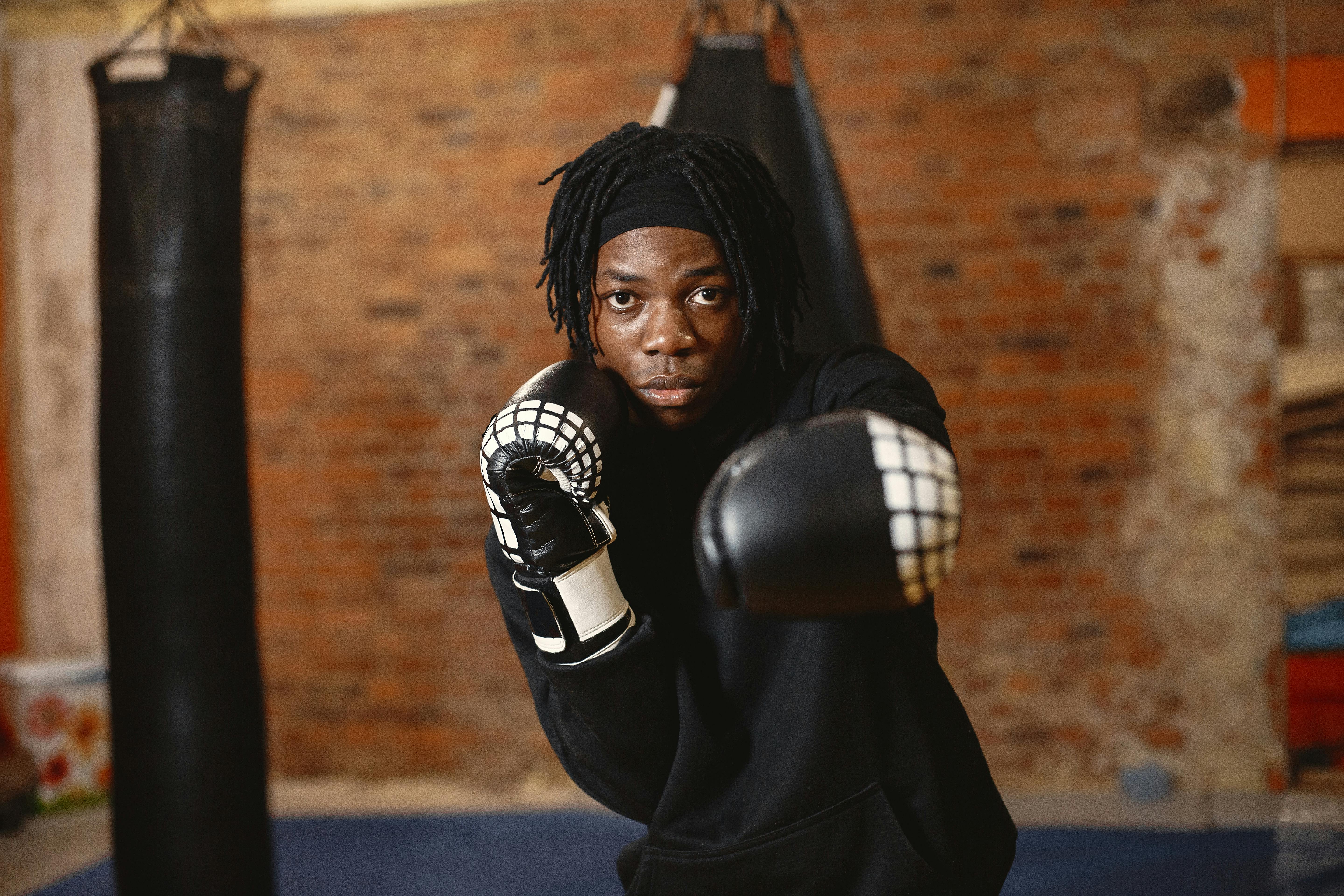Woman in Black Leather Boxing Gloves · Free Stock Photo