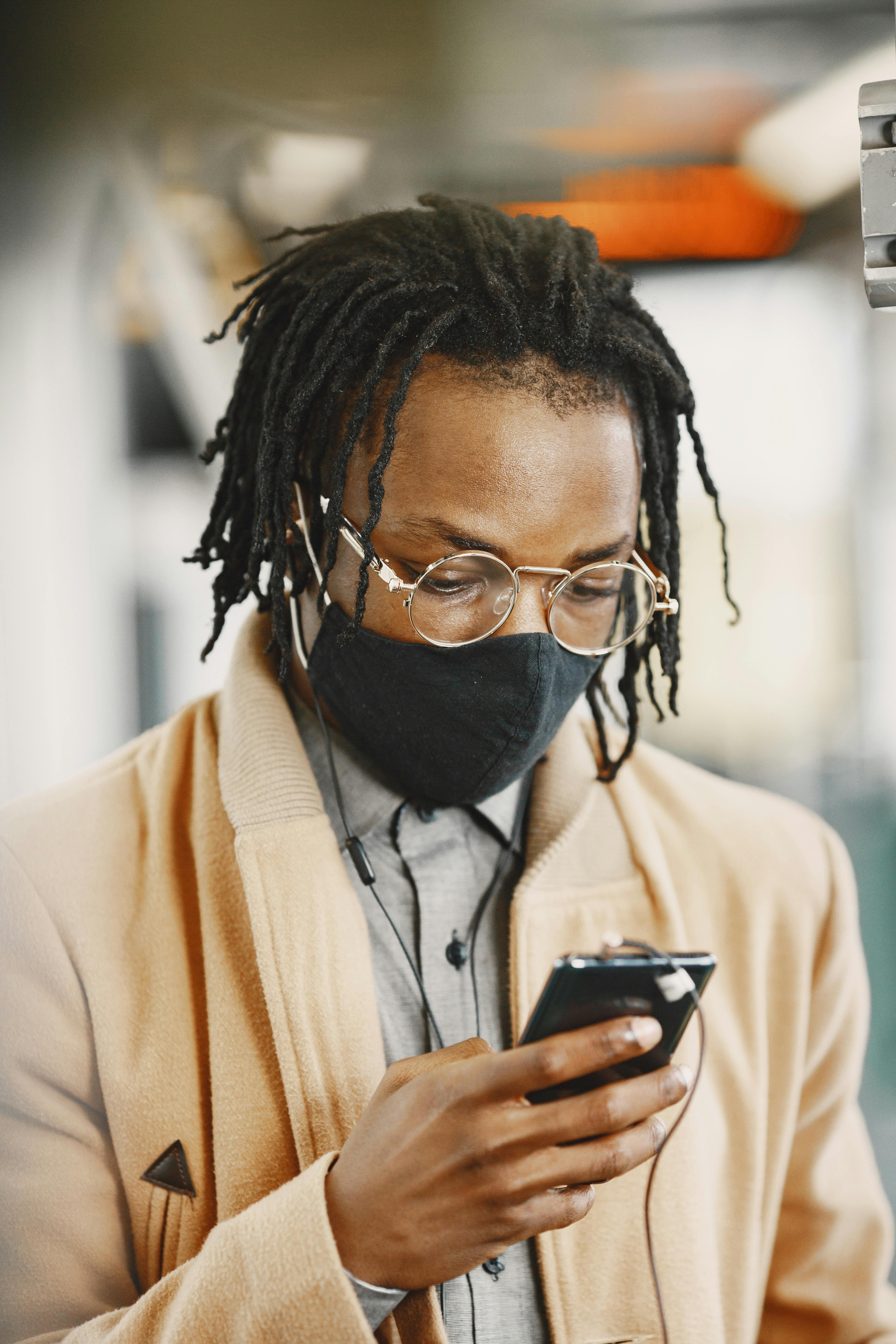 A Man Looking at His Phone · Free Stock Photo