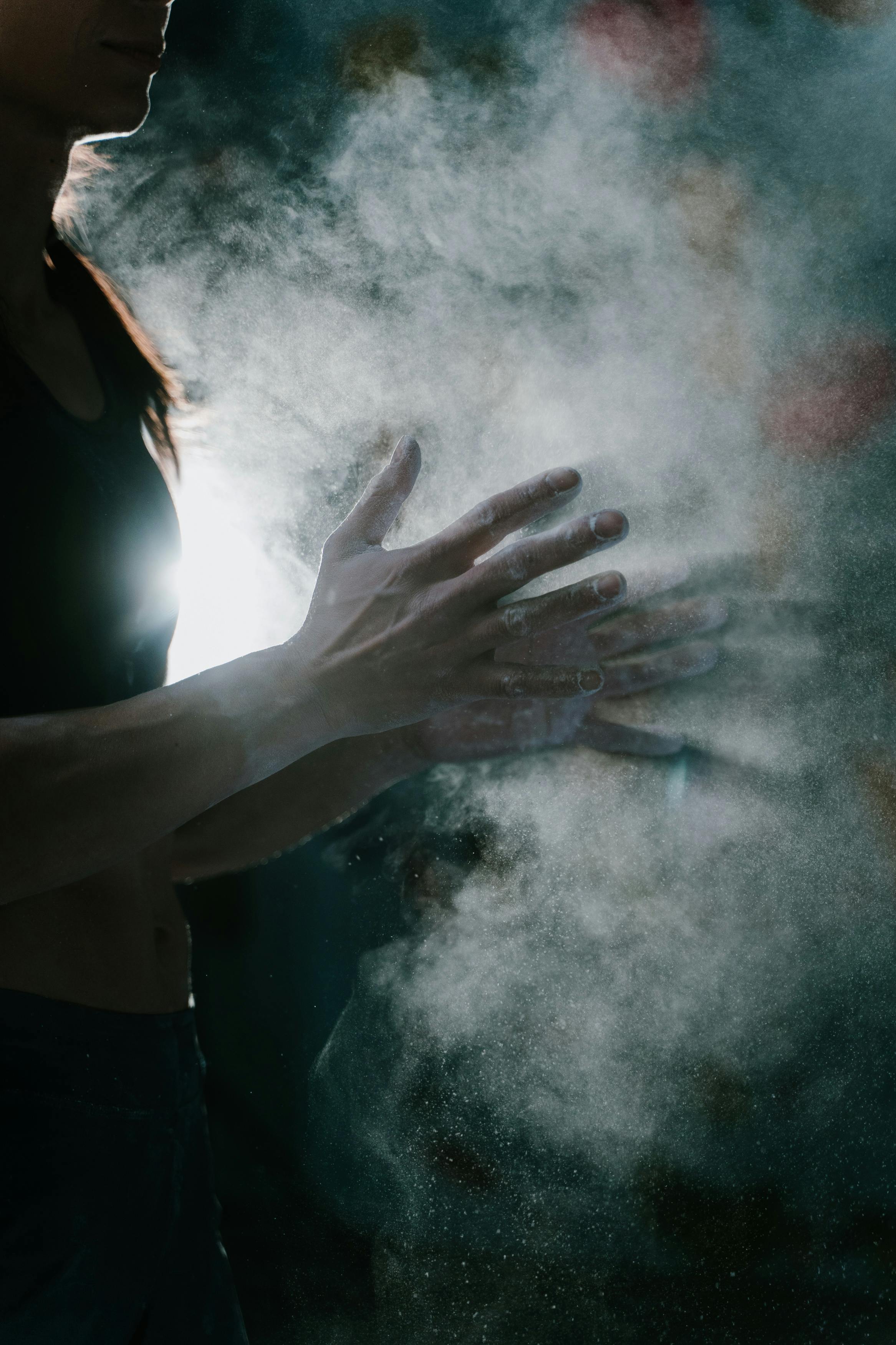 A Climber Clapping with Climbing Chalk · Free Stock Photo