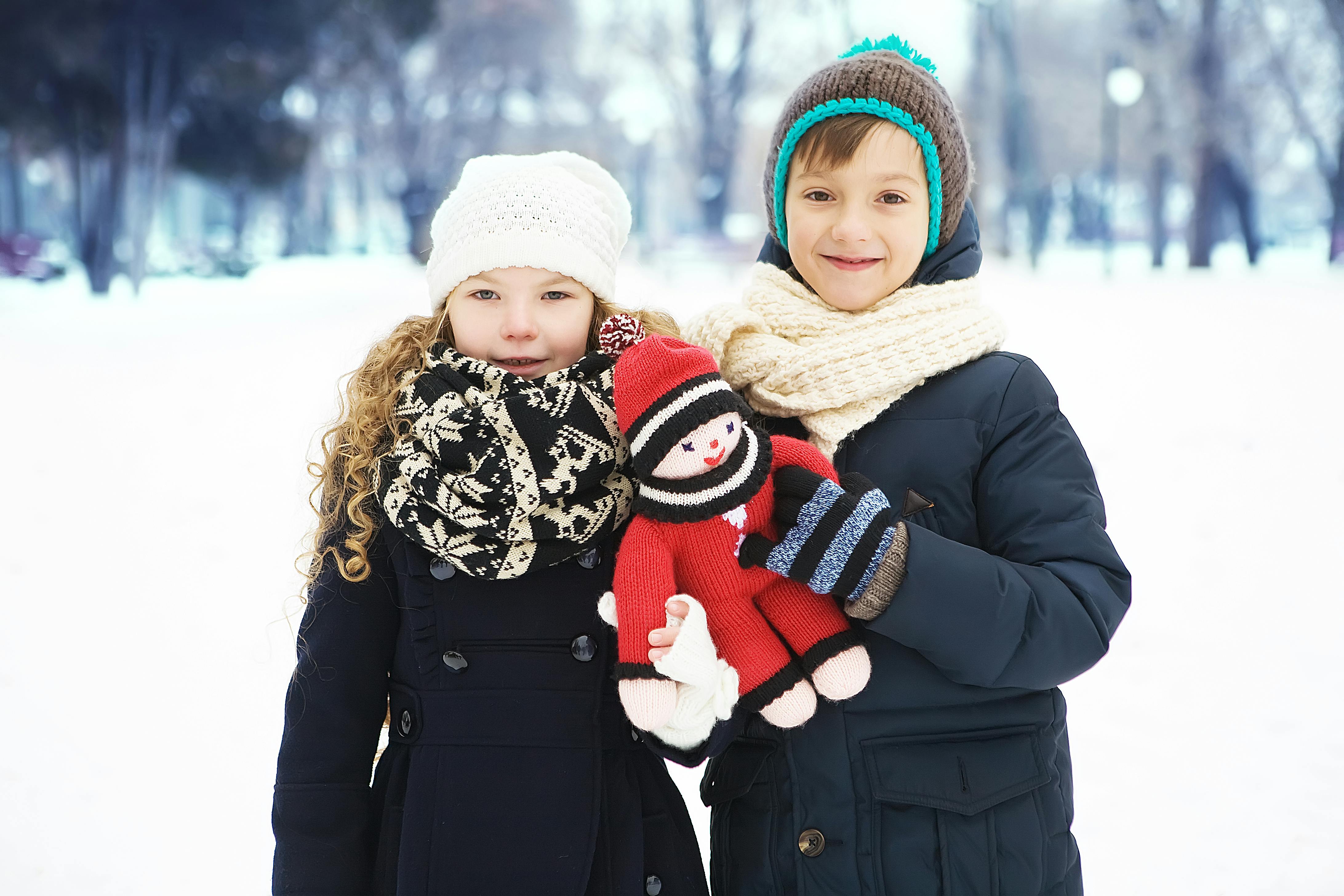 A Boy and Girl Wearing Winter Clothes · Free Stock Photo
