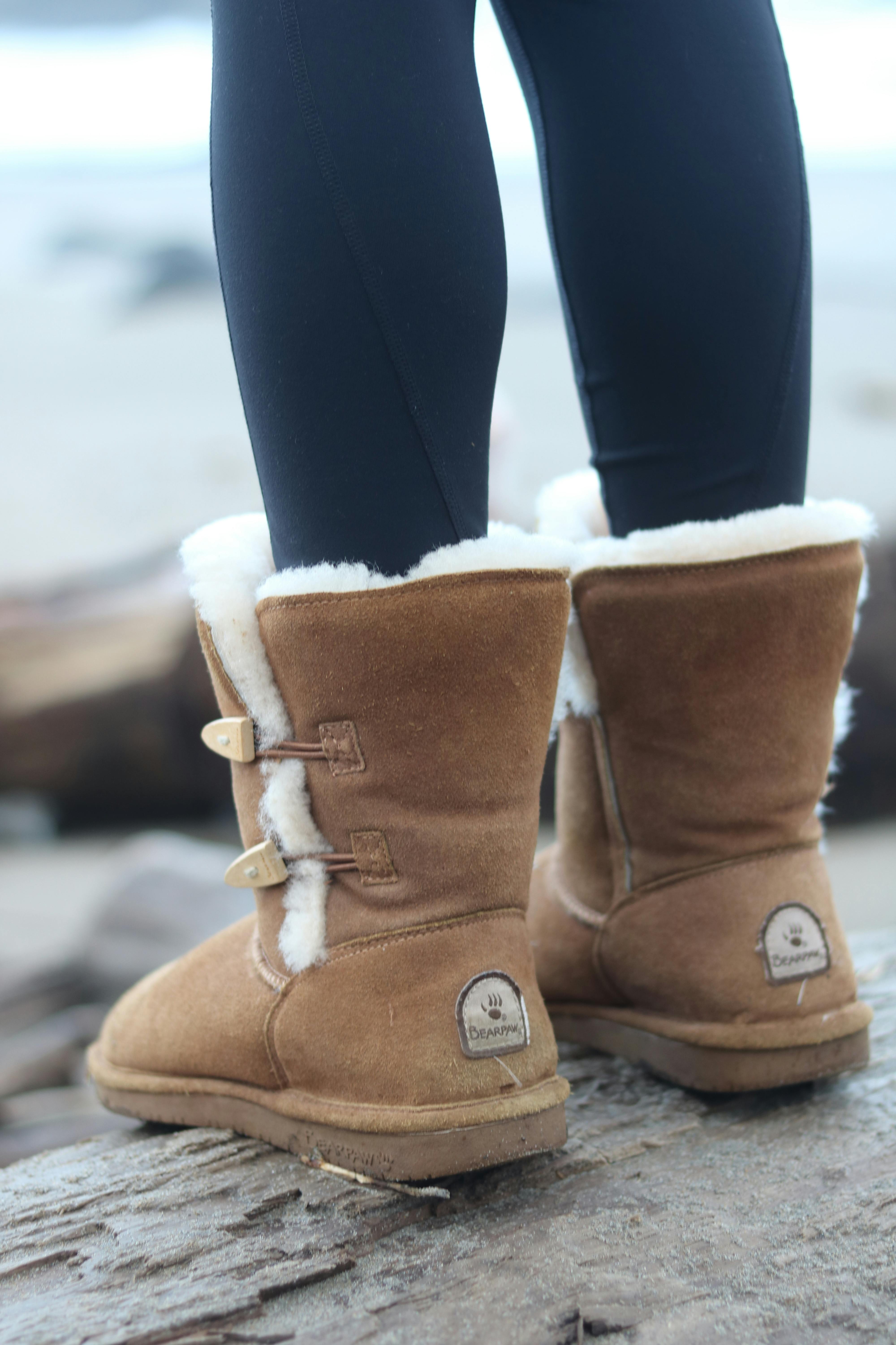 A Person Wearing White Prada Boots · Free Stock Photo