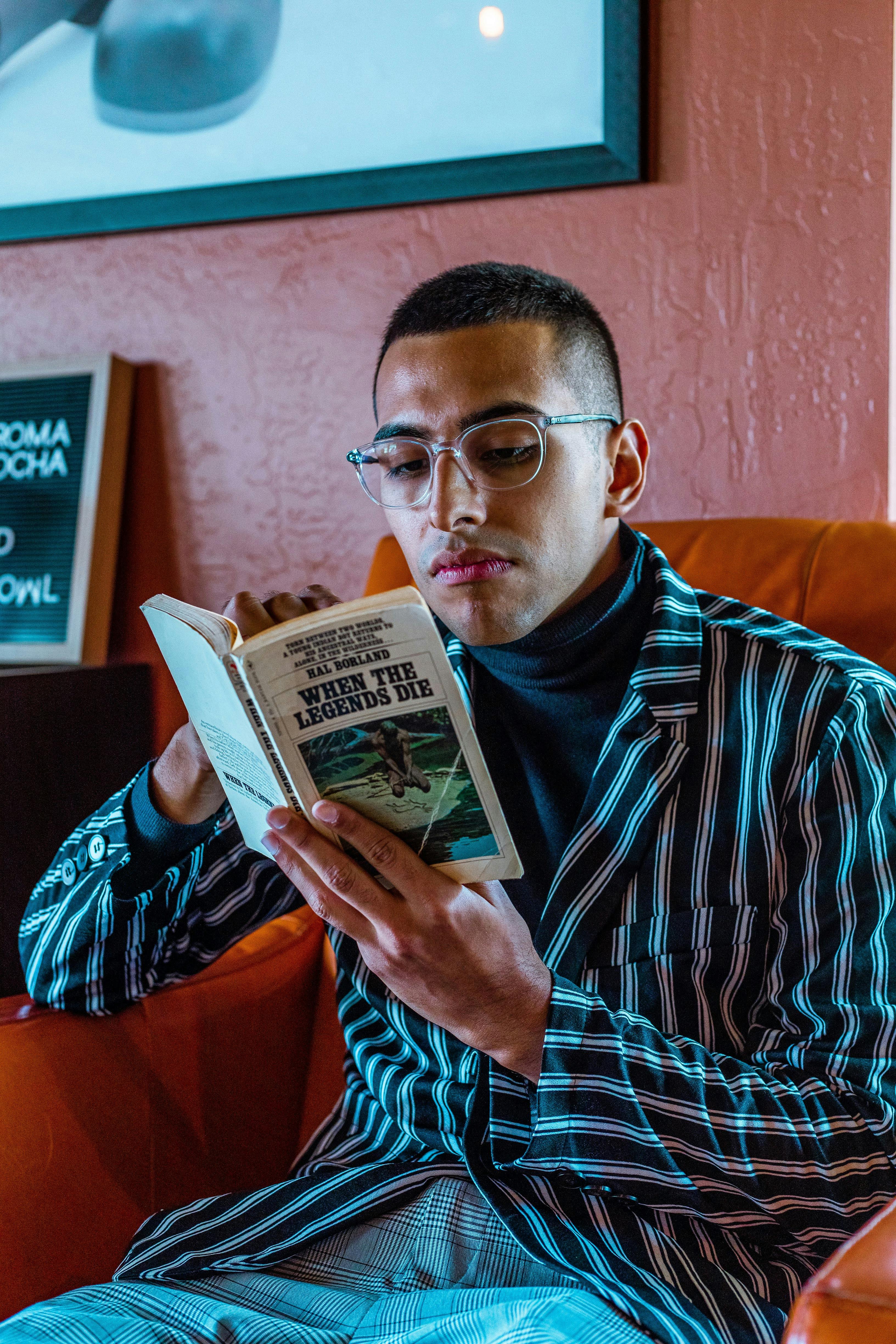 Photo Of Man Reading Book · Free Stock Photo