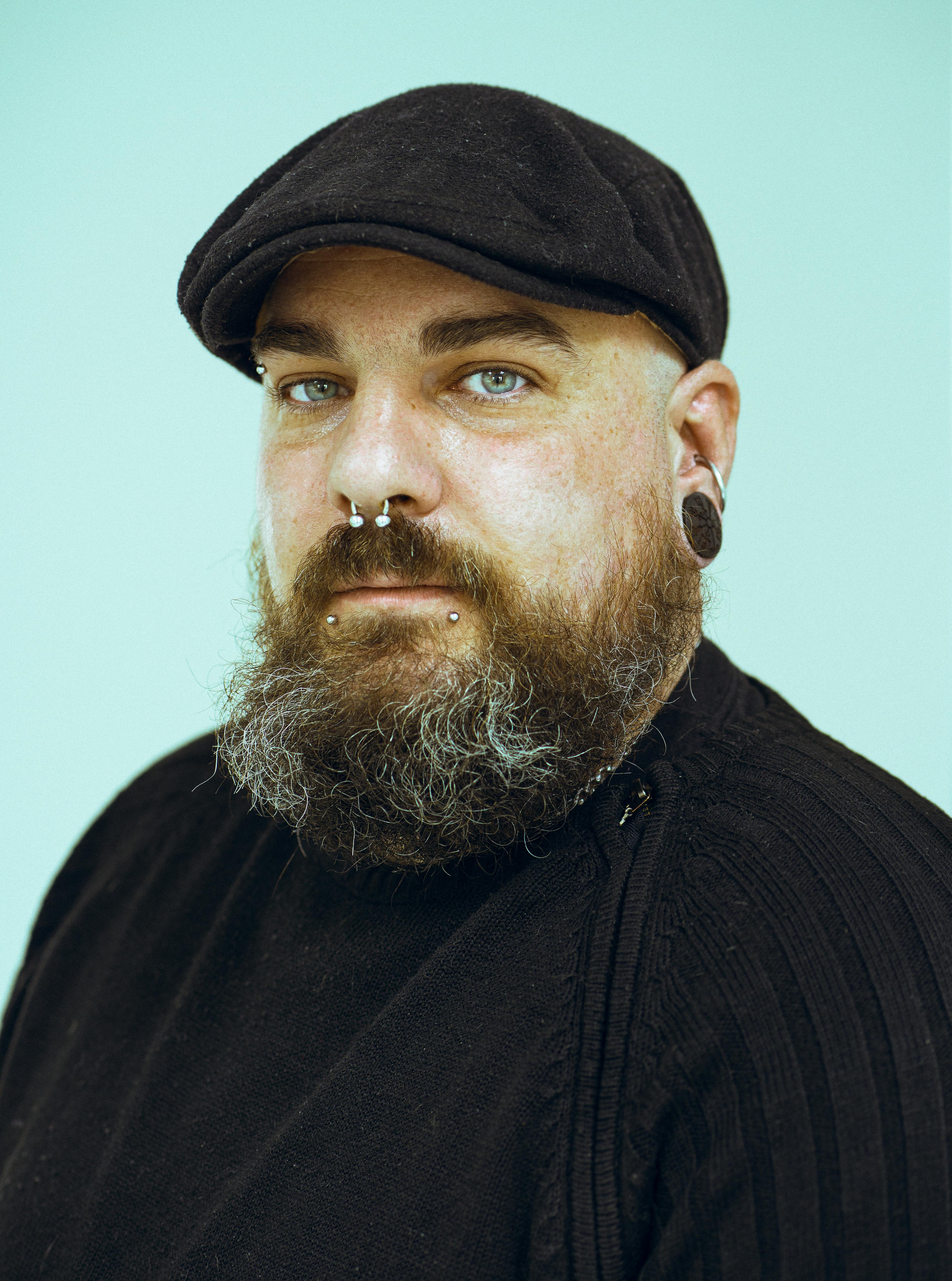 A Bearded Man Wearing Cap · Free Stock Photo