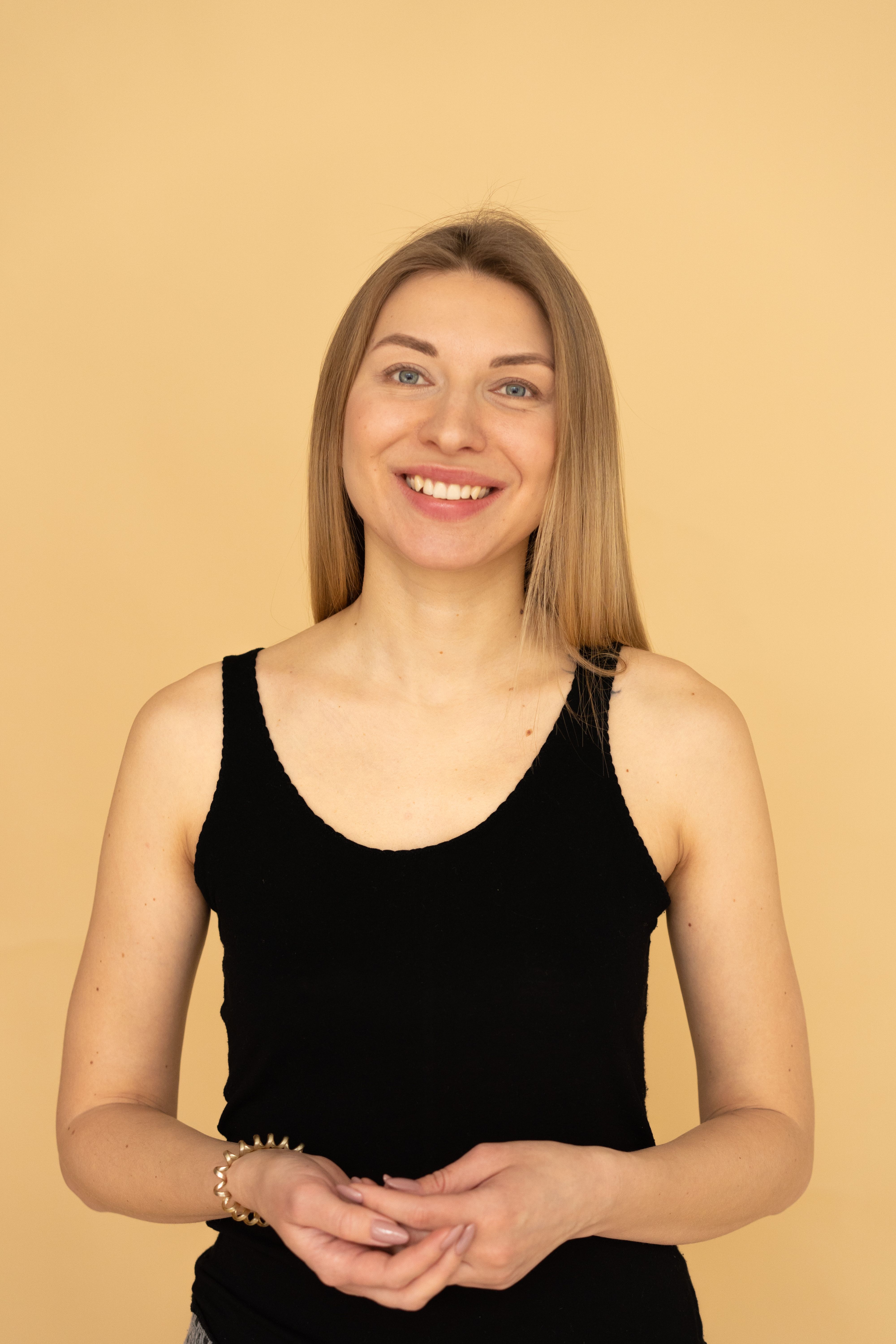 Woman in White Tank Top Smiling · Free Stock Photo