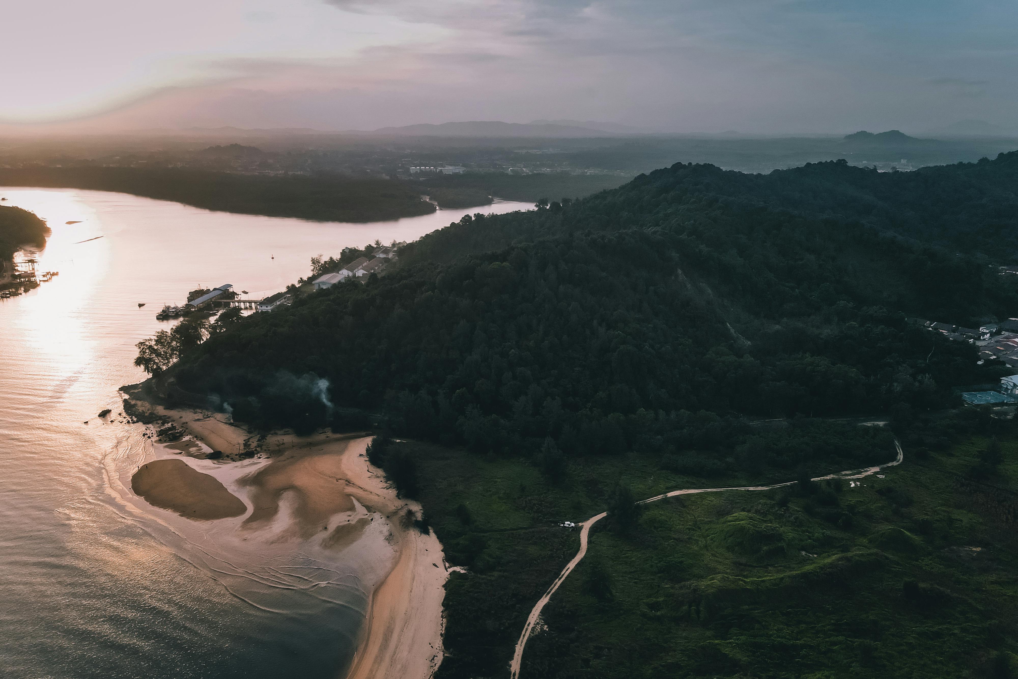 Aerial View of a River and Mountains at Sunset · Free Stock Photo