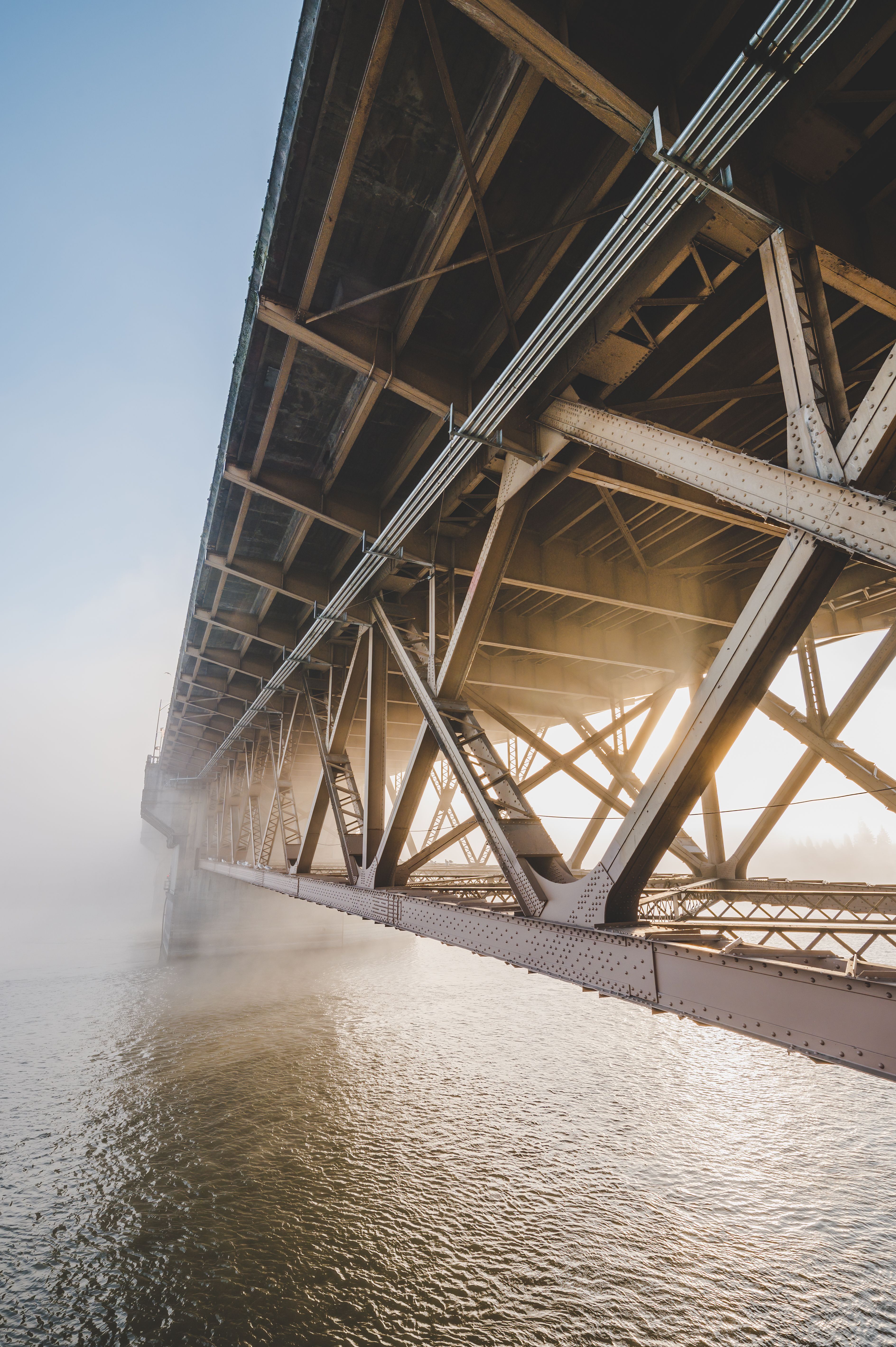 Modern bridge over rippling river · Free Stock Photo