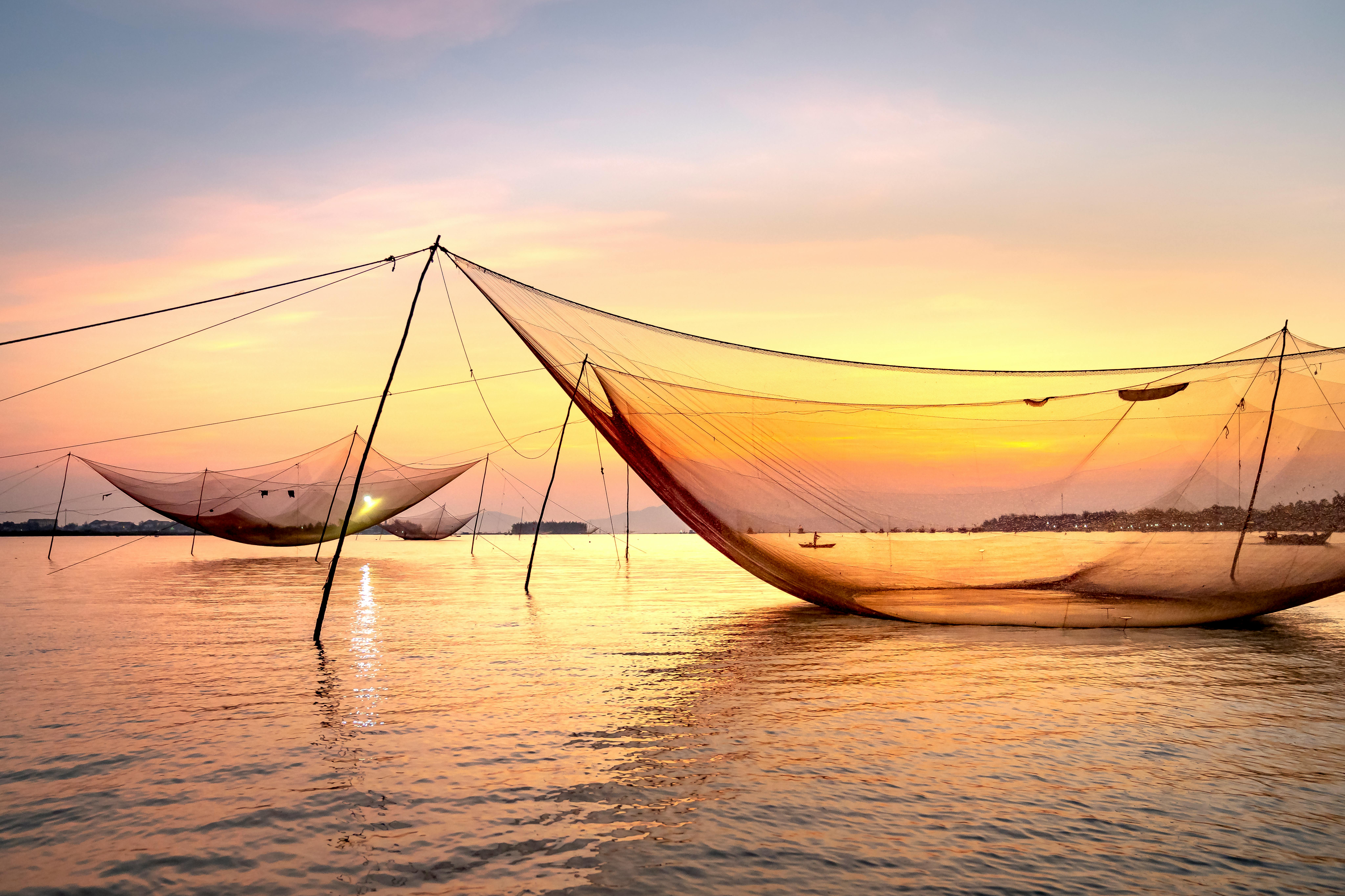 Fishing nets against sunset sky · Free Stock Photo