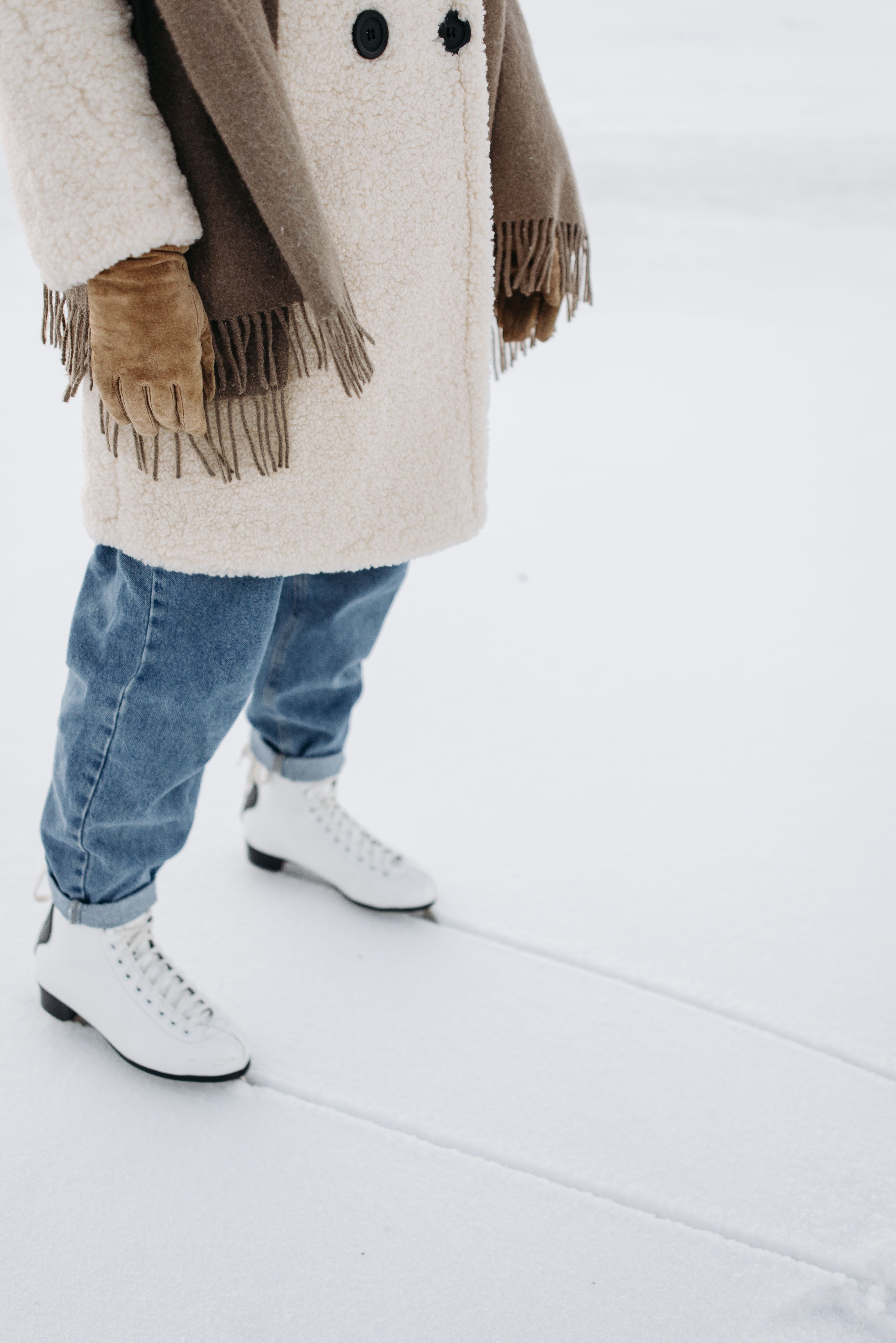 Person in Blue Denim Jeans Wearing Ice Skates · Free Stock Photo
