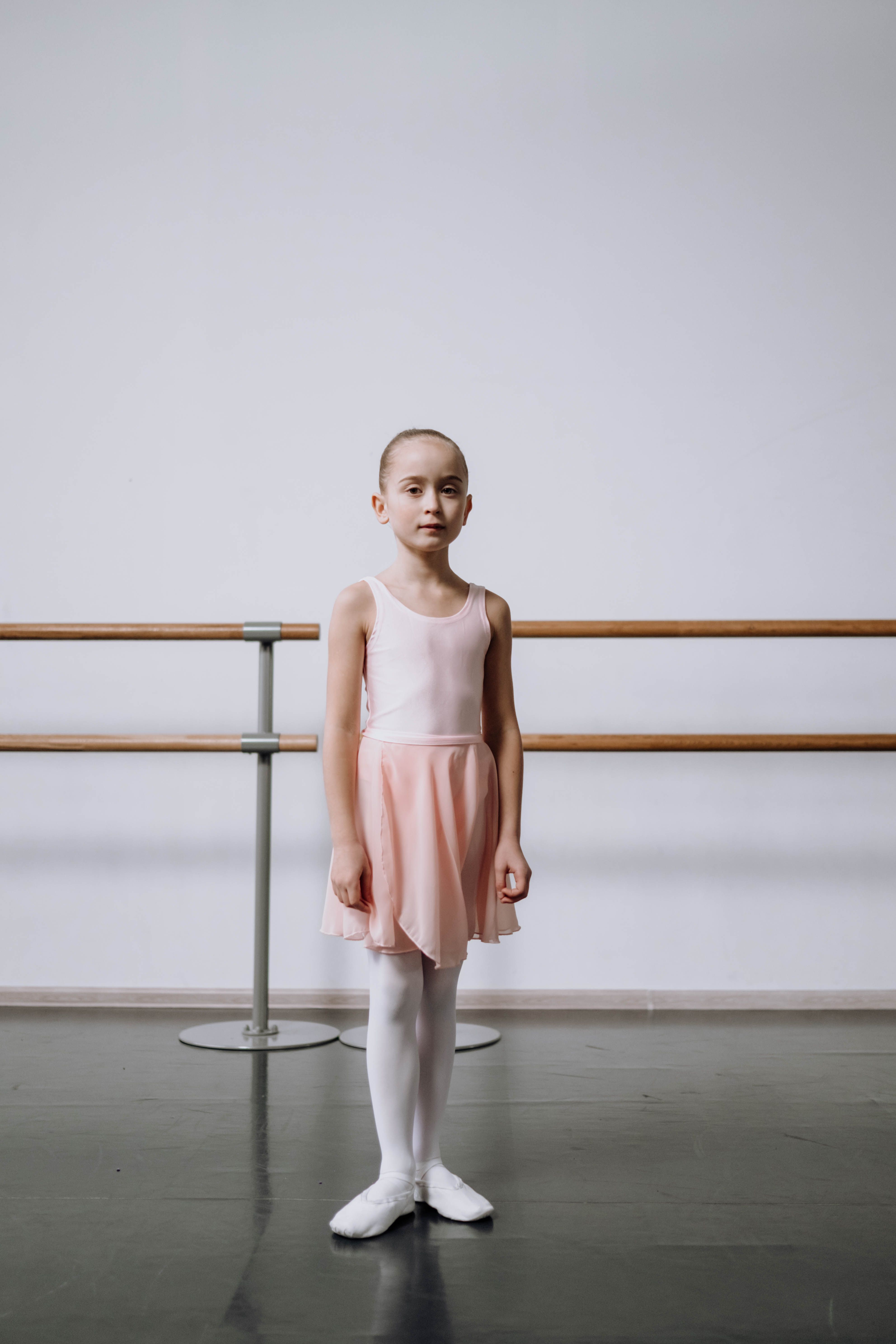 Three Little Girls in Pink Leotards Jumping · Free Stock Photo