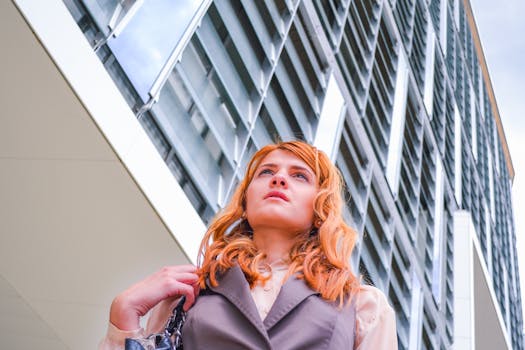 Woman Looking at Modern Office Building · Free Stock Photo