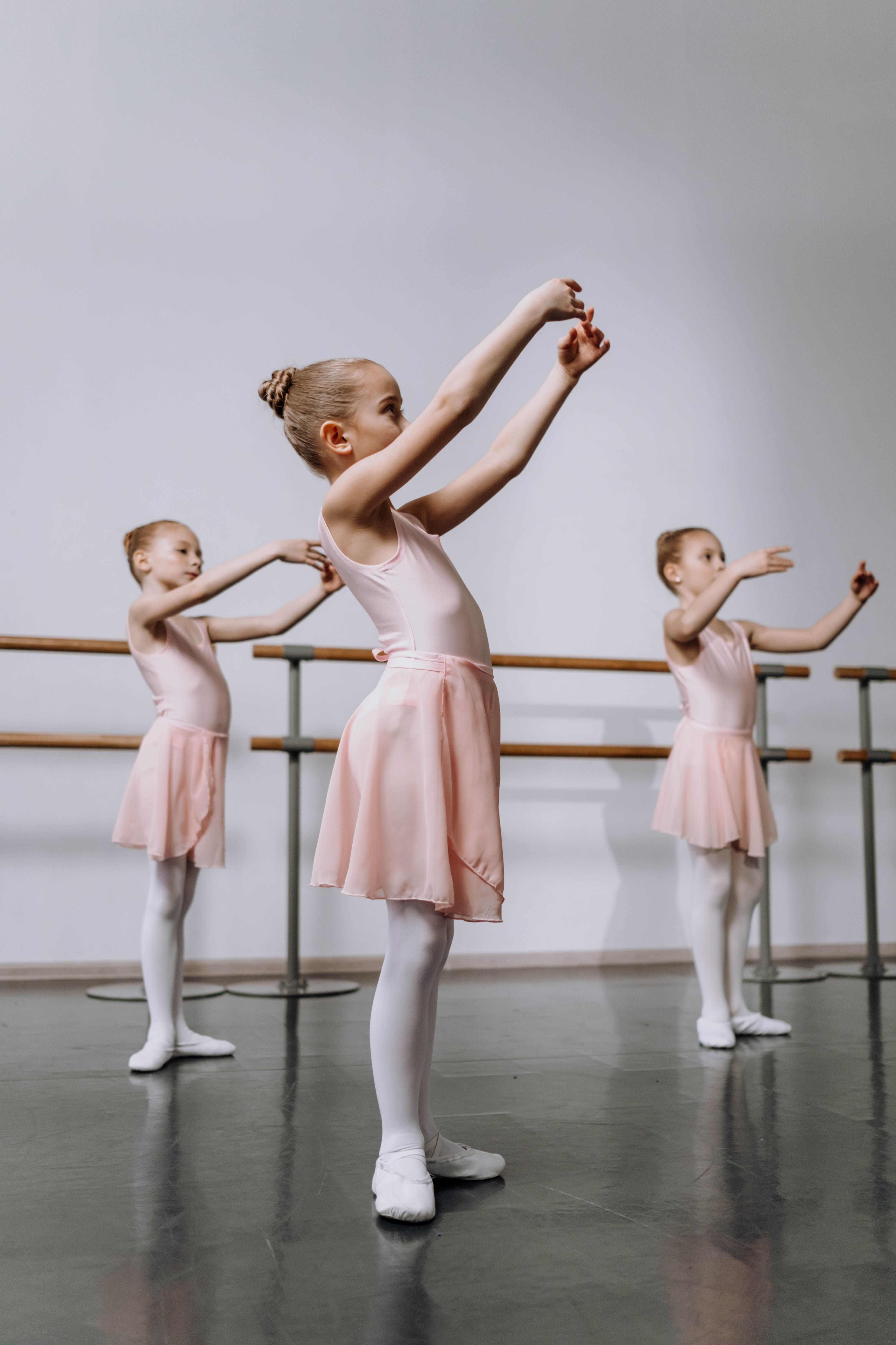 Girls n Pink Dress Practicing Ballet in the Studio · Free Stock Photo