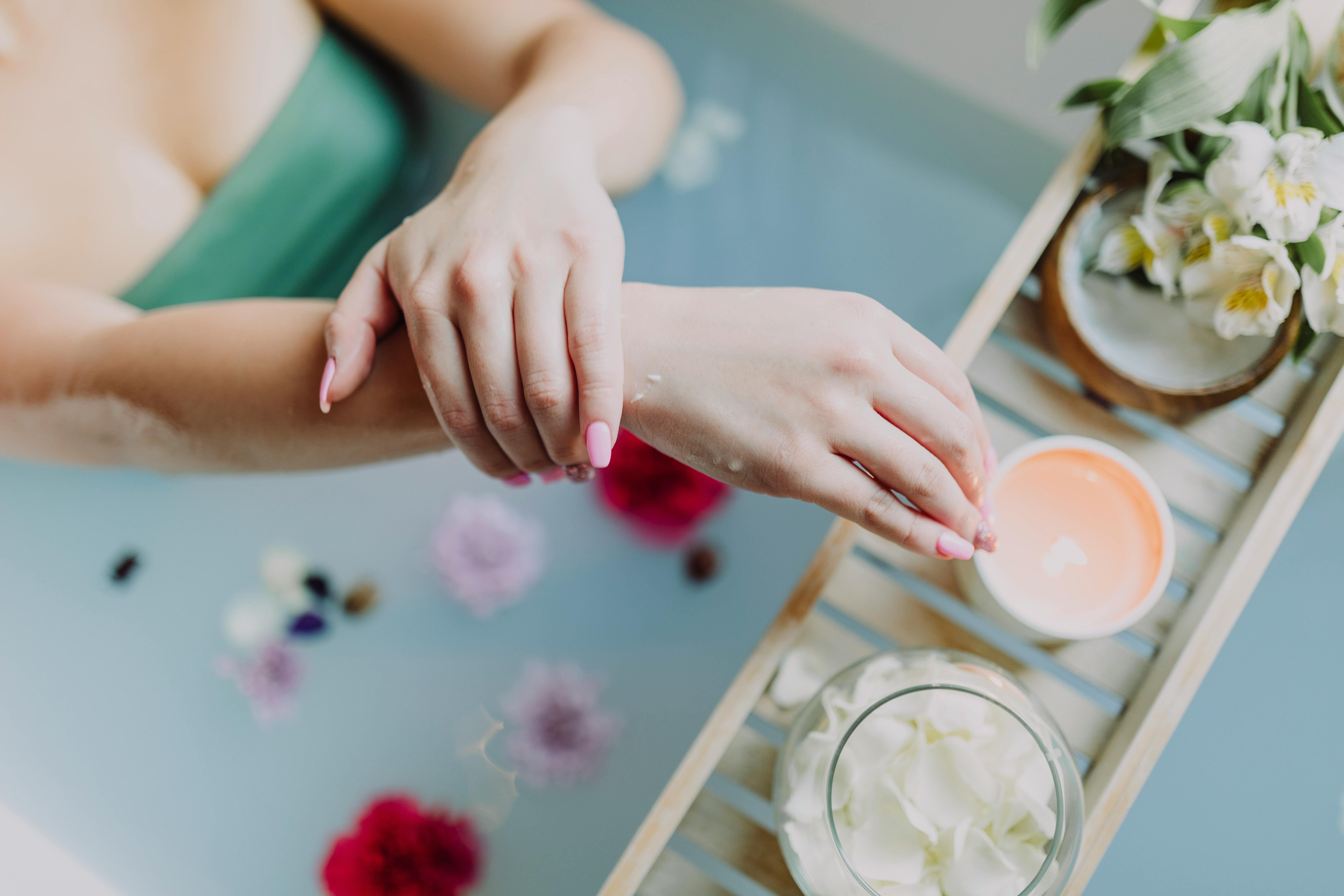 Close-Up Photo of a Person Using a Body Scrub · Free Stock Photo