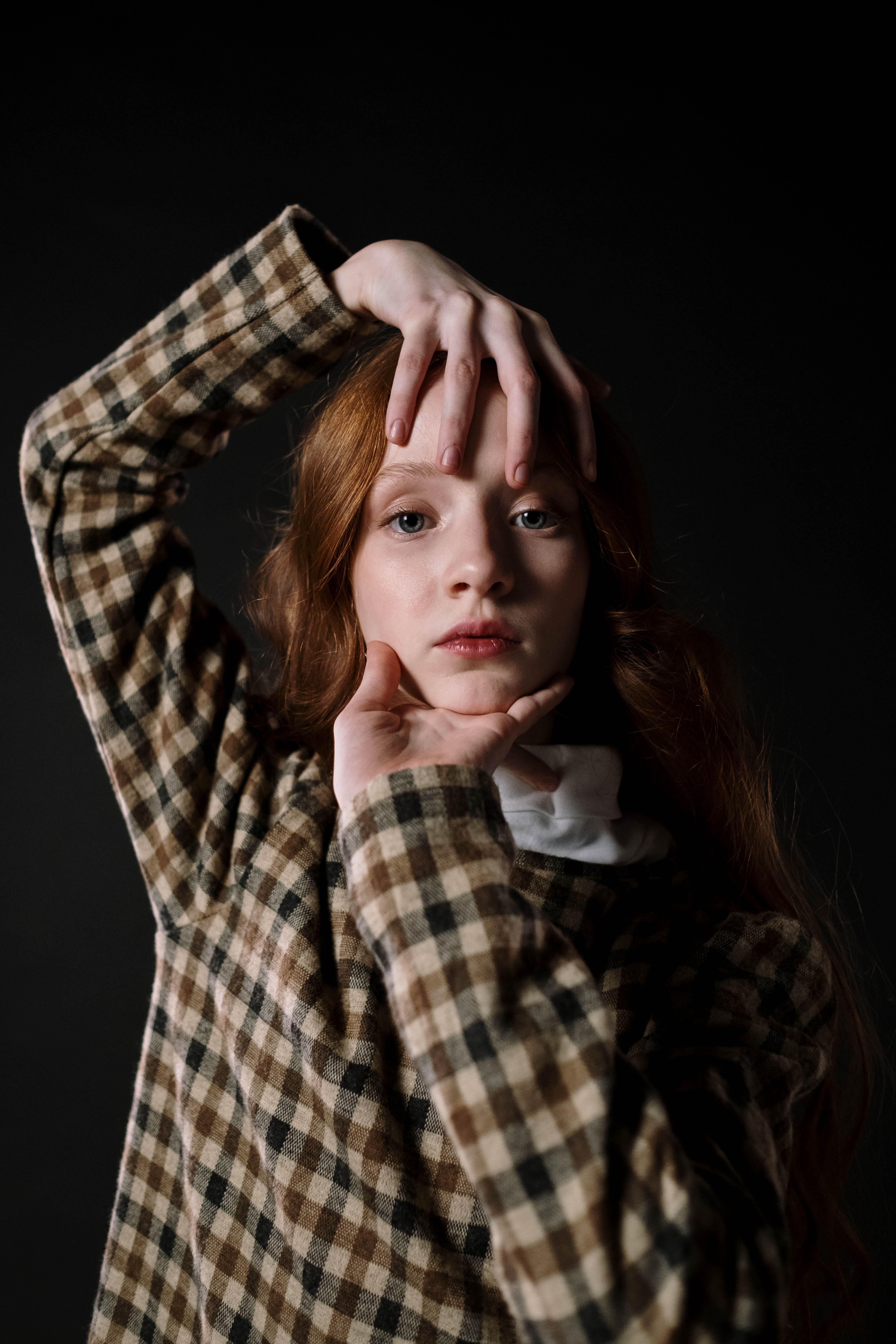 A Girl Putting her Hands on Face while Posing · Free Stock Photo