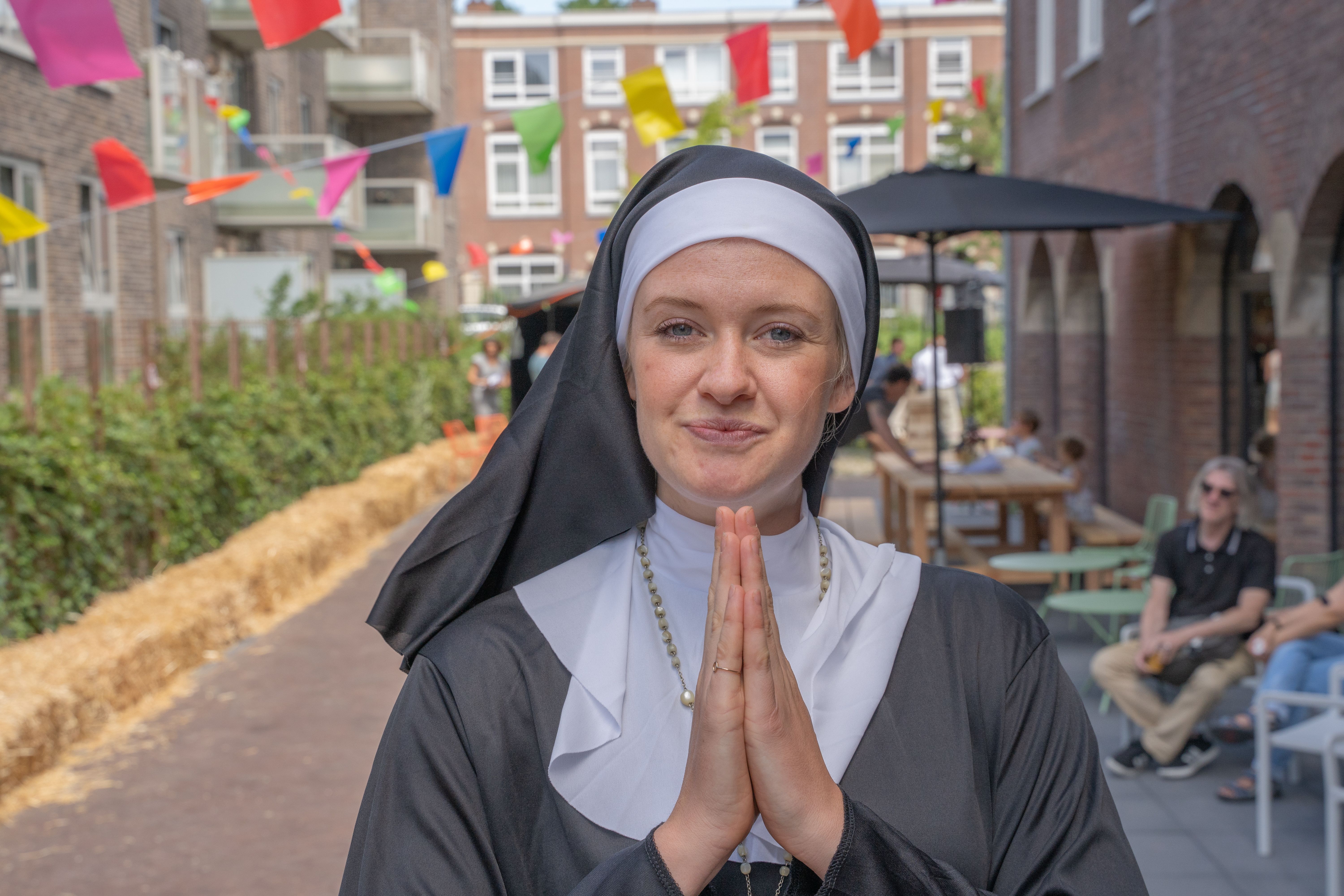 Photo of a Nun Holding a Rosary · Free Stock Photo