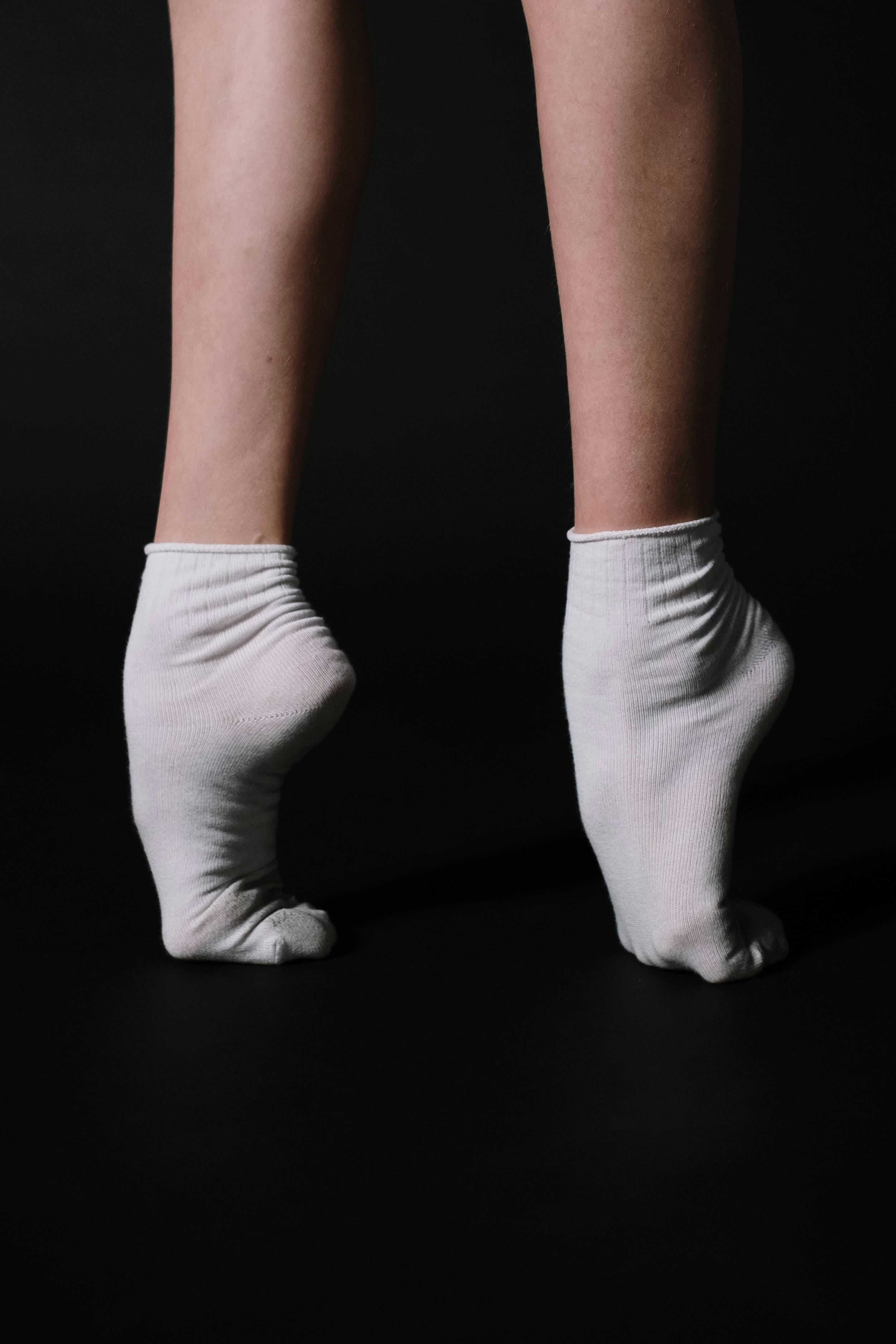 Person Wearing Blue Black Yellow Red Socks · Free Stock Photo