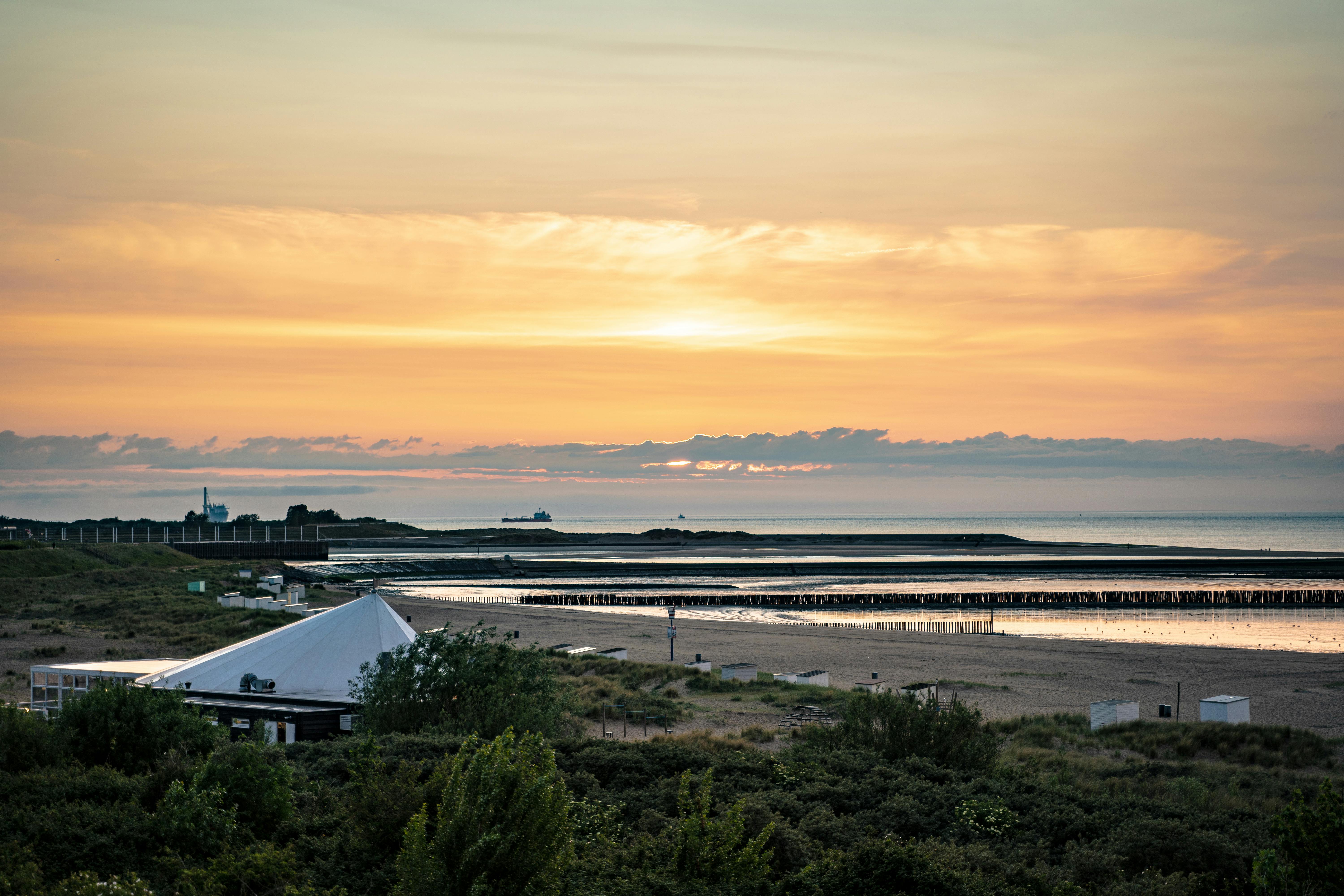 Sandy Beach at Sunrise and Yellow Sky · Free Stock Photo
