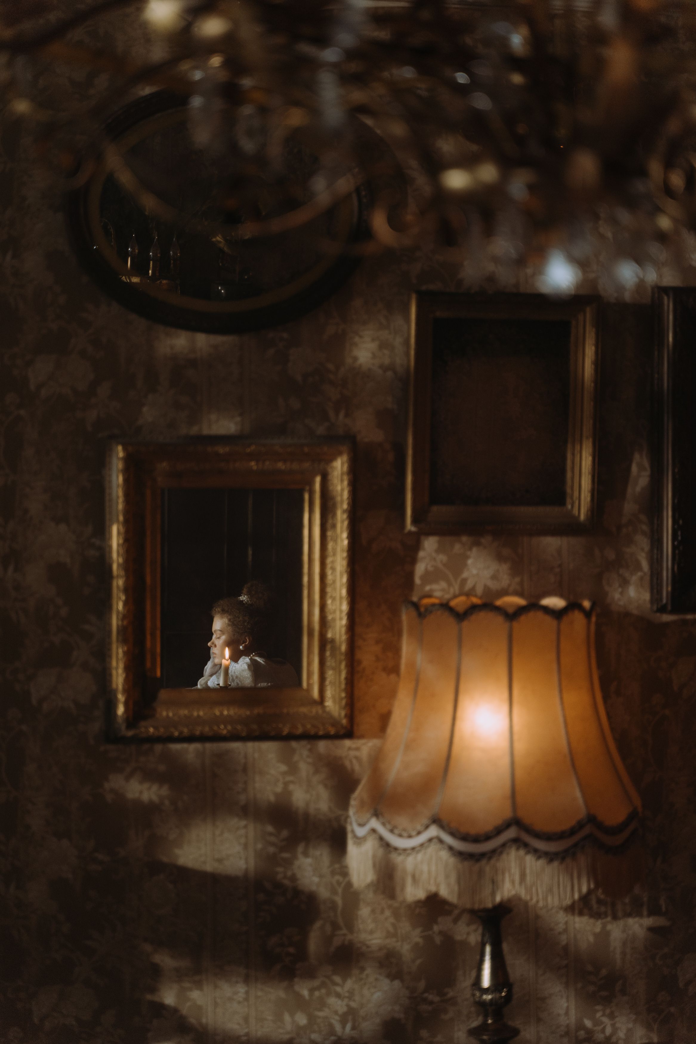 A Mirror Reflection of a Woman Beside a Candlelight · Free Stock Photo