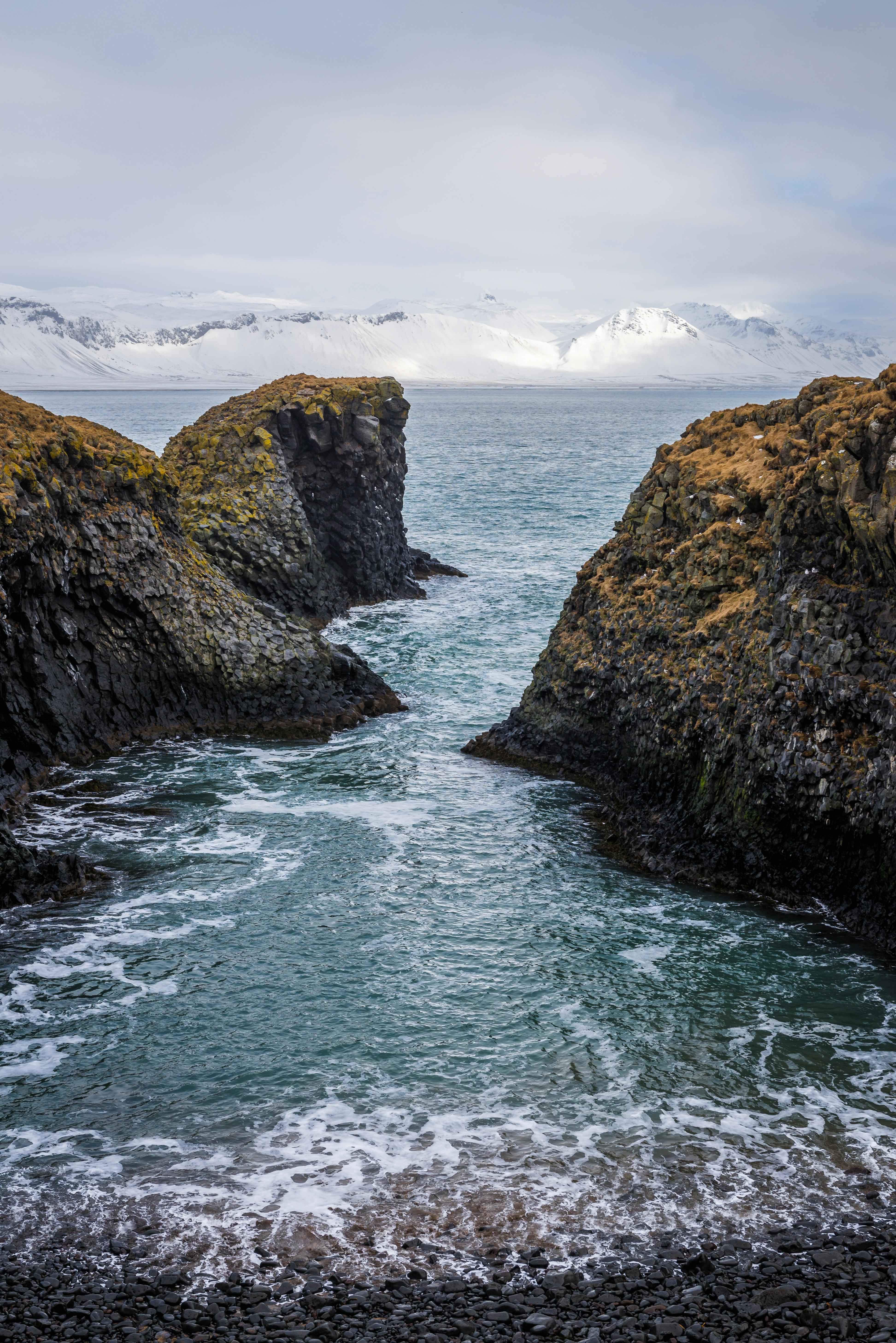 Photography of a Person Standing on Cliff · Free Stock Photo