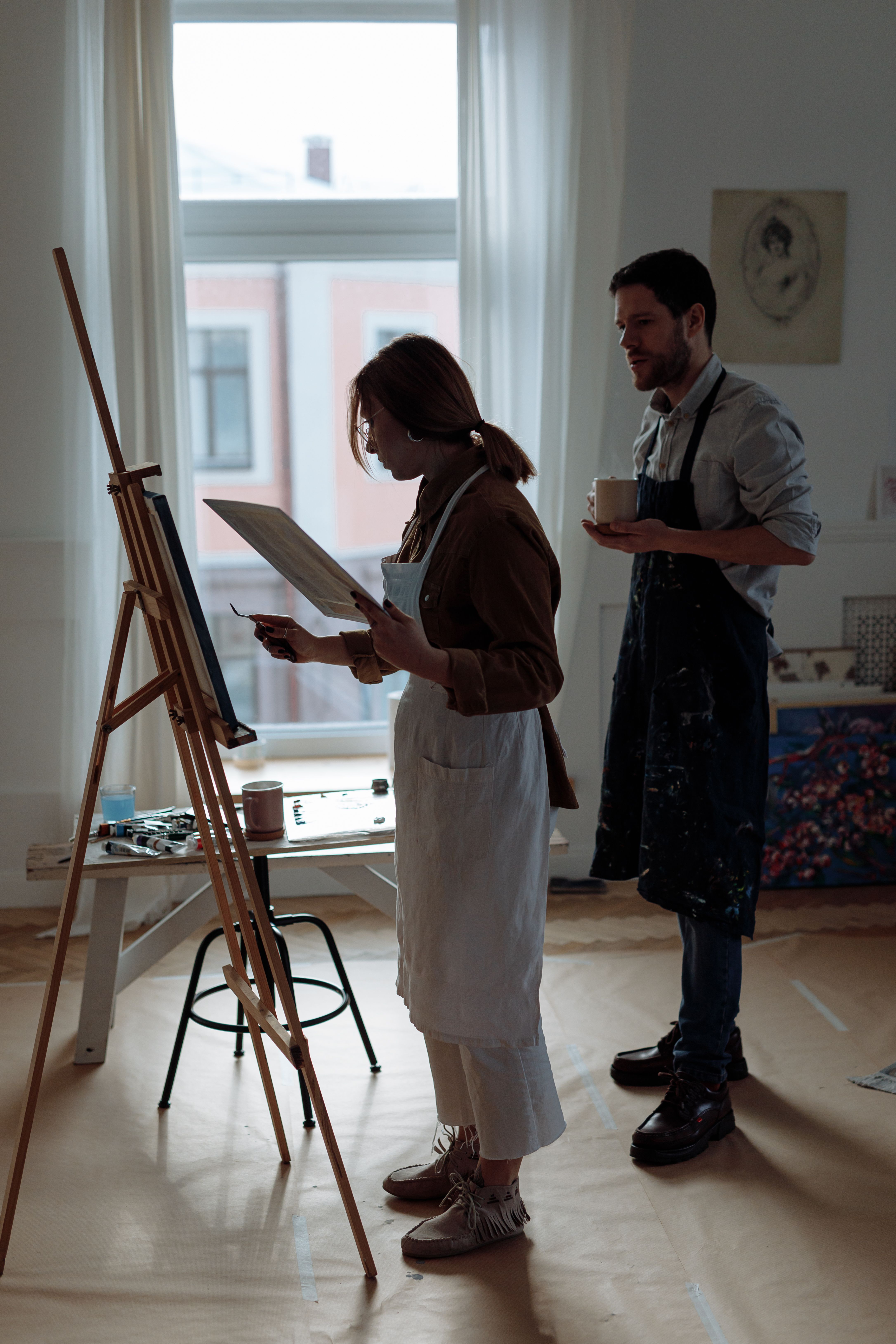 Painters looking at a Painting · Free Stock Photo