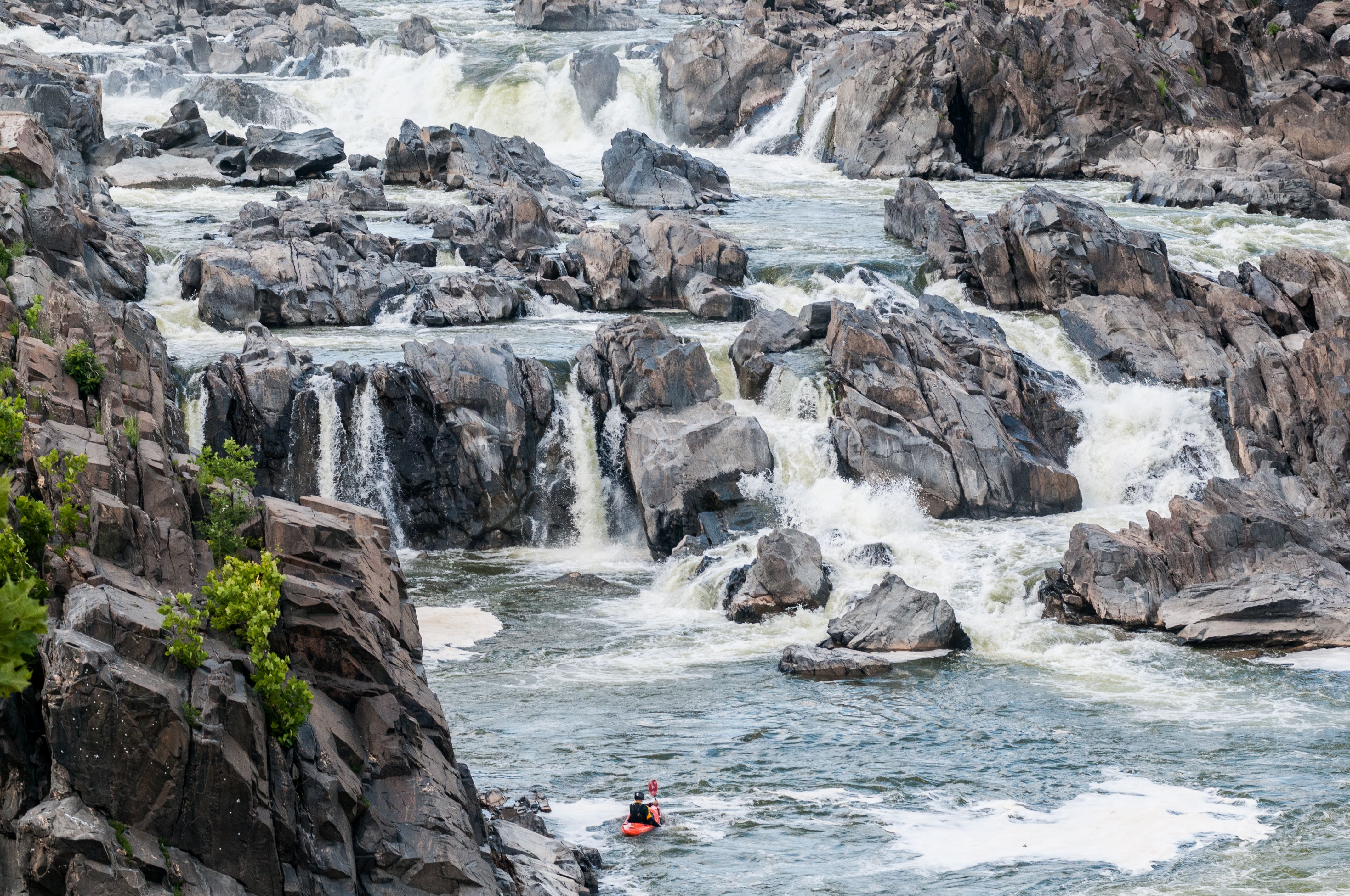 Photo of Man Paddling Kayak in Raging River · Free Stock Photo