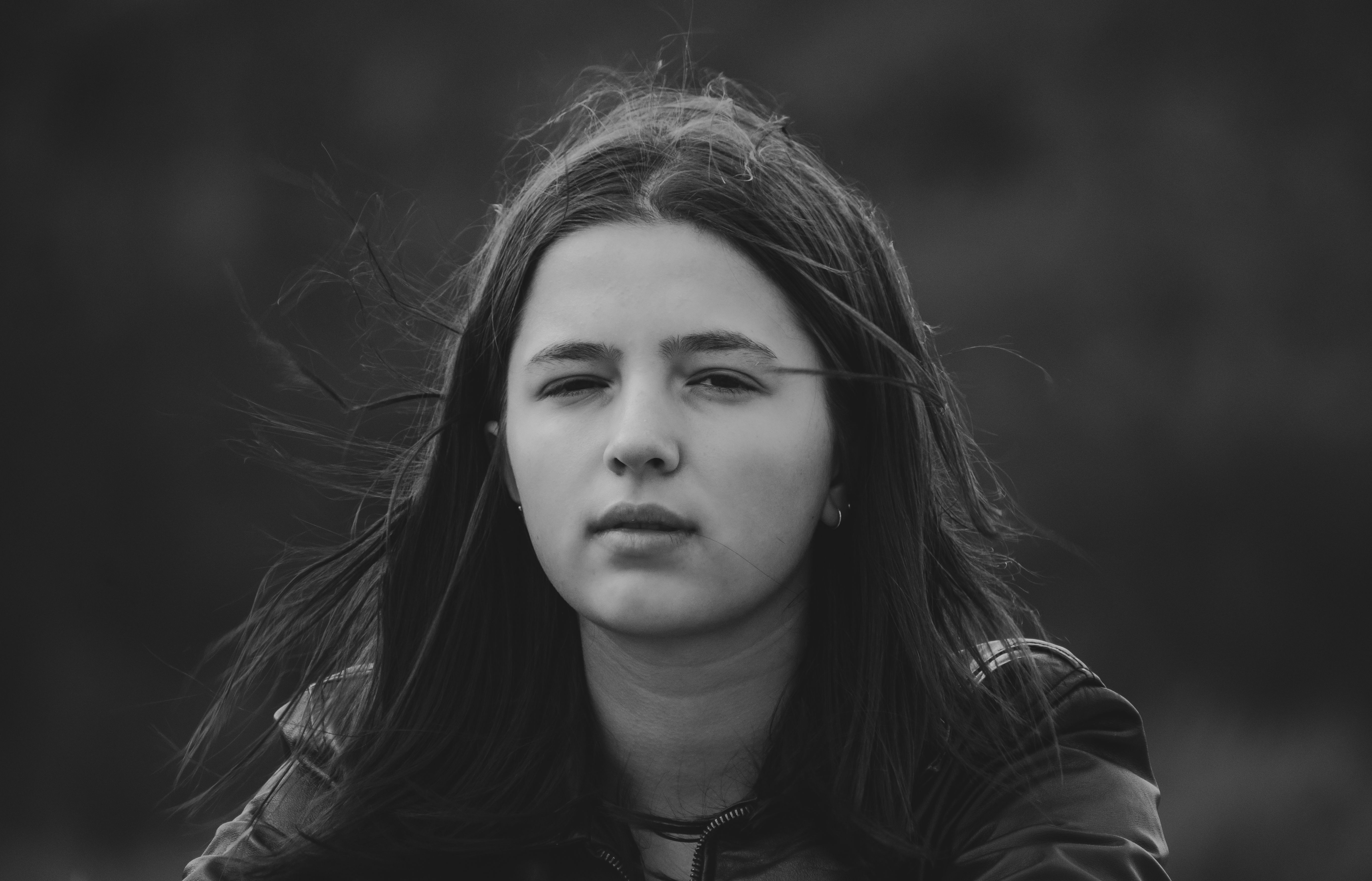 Trendy millennial relaxing in park and looking at camera · Free Stock Photo