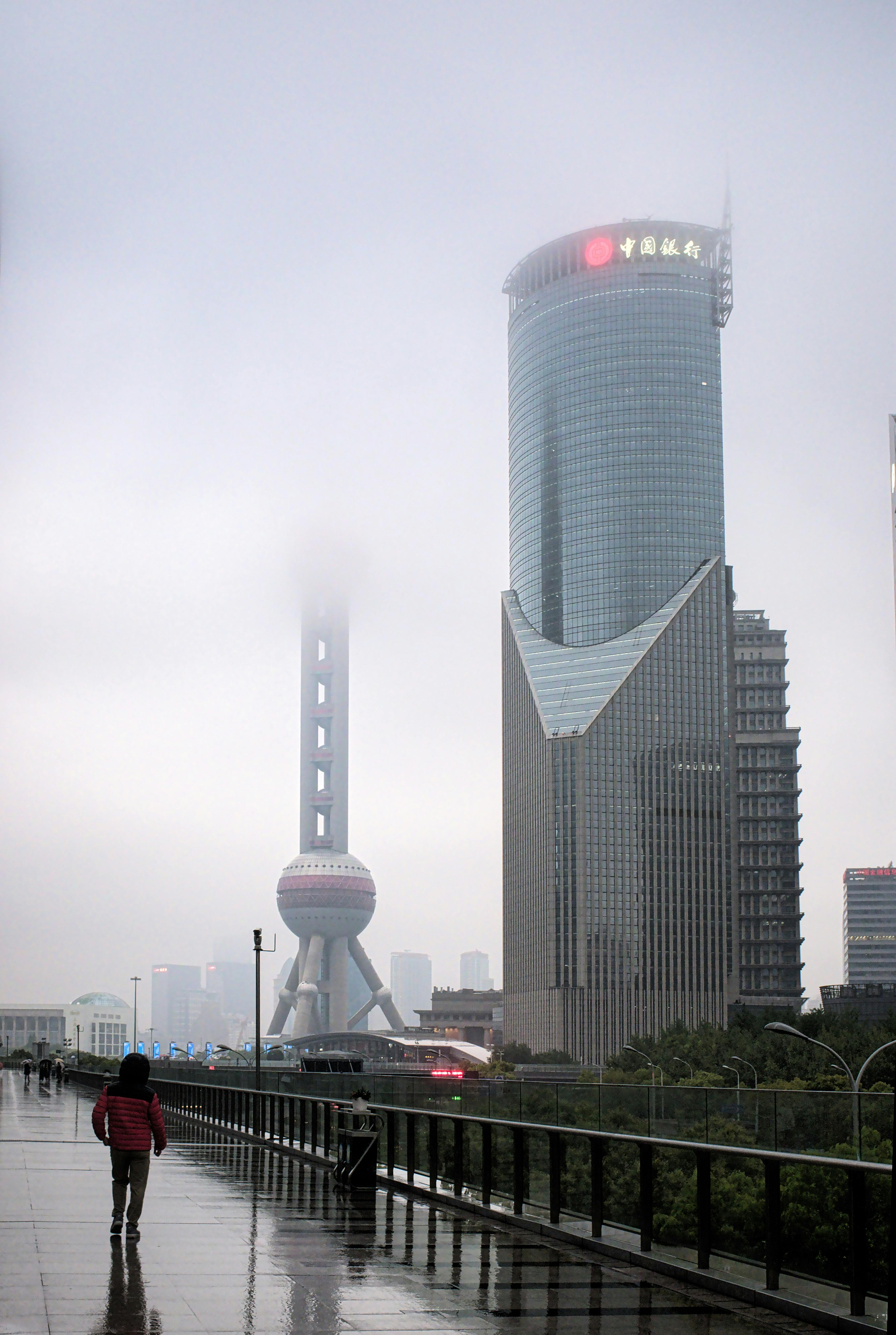 Low-angle Photography of Buildings Covered by Fog · Free Stock Photo