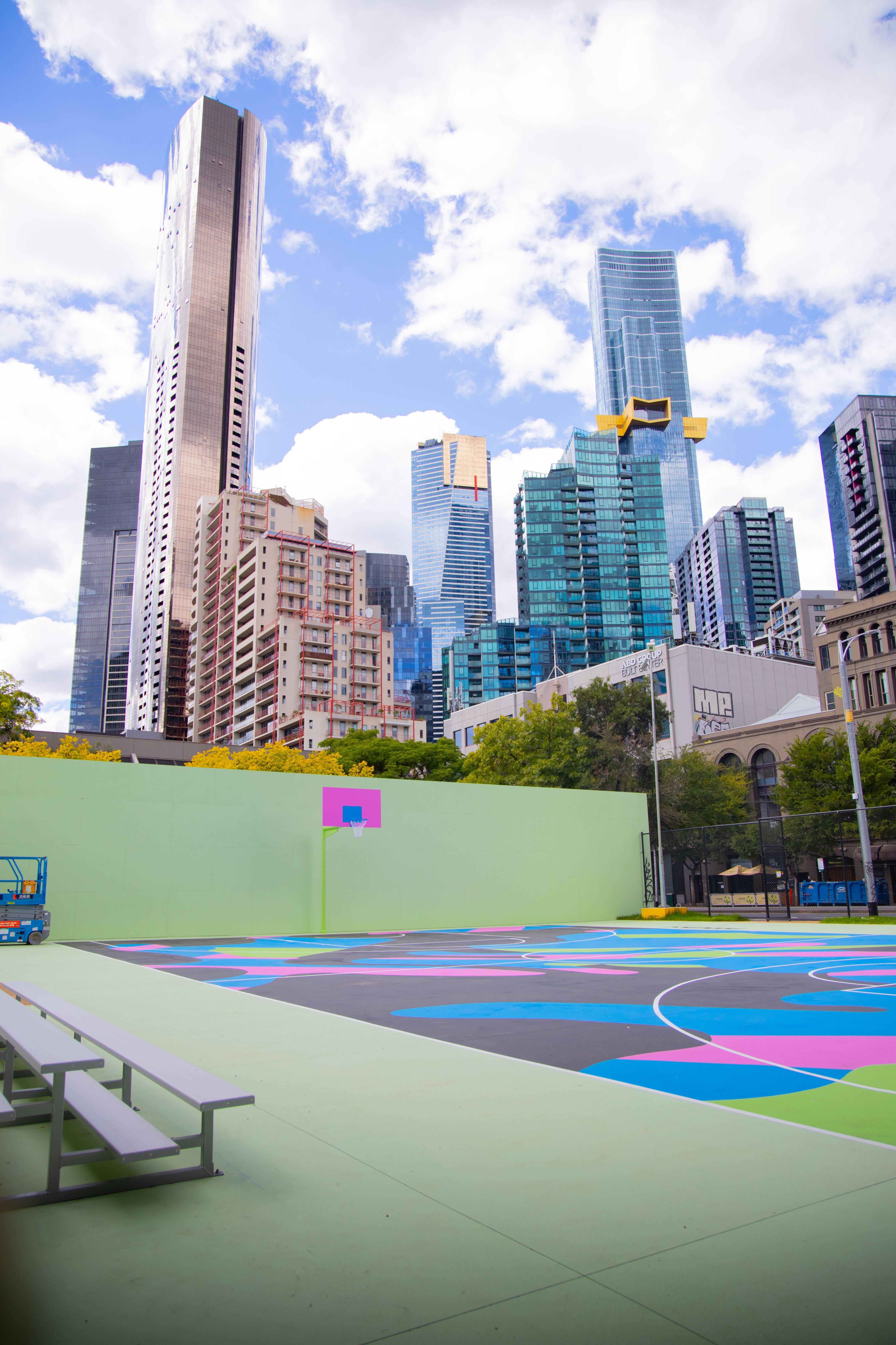 A Colorful Basketball Court Near City Buildings · Free Stock Photo