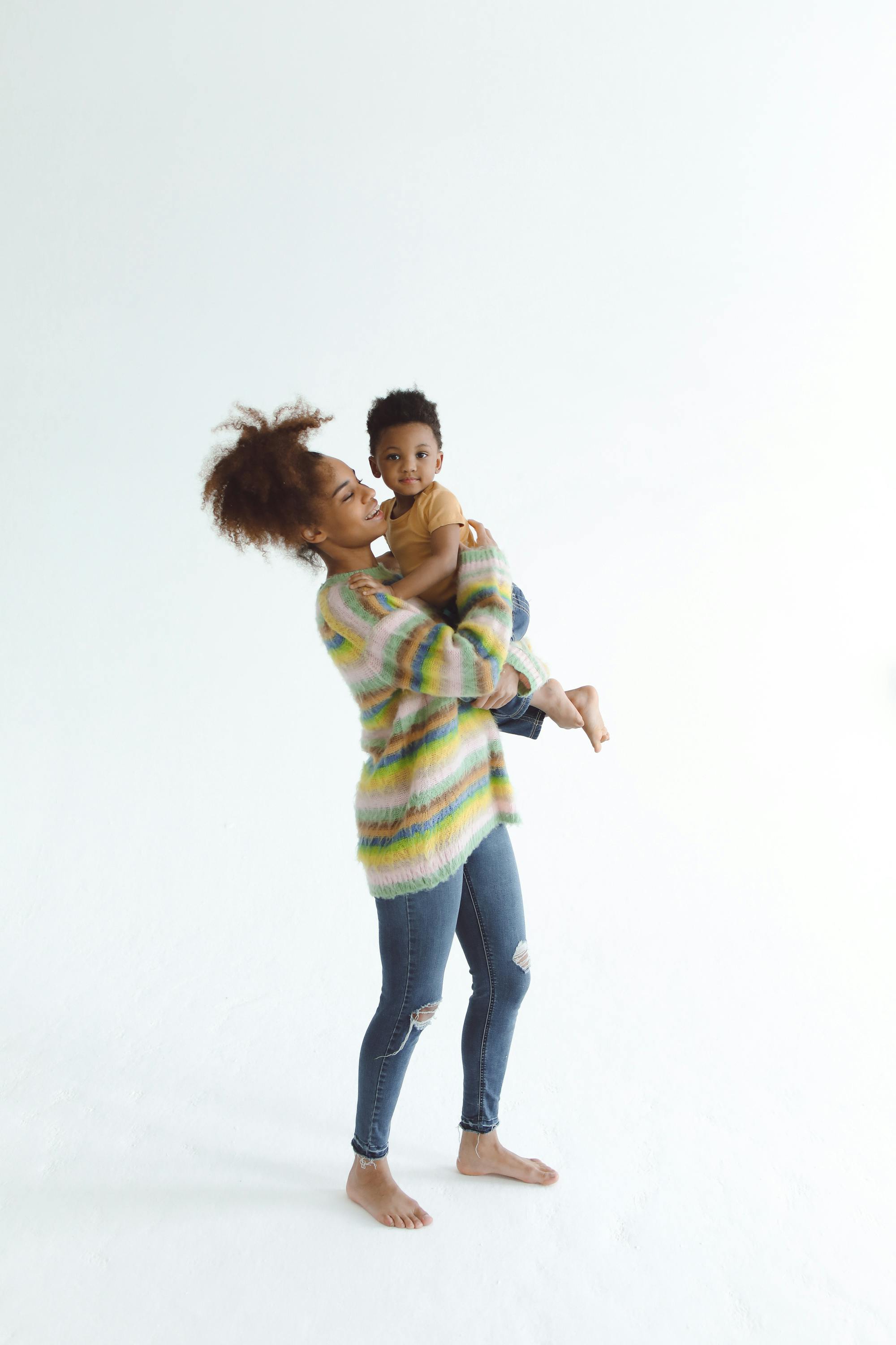 Woman Carrying a Child · Free Stock Photo