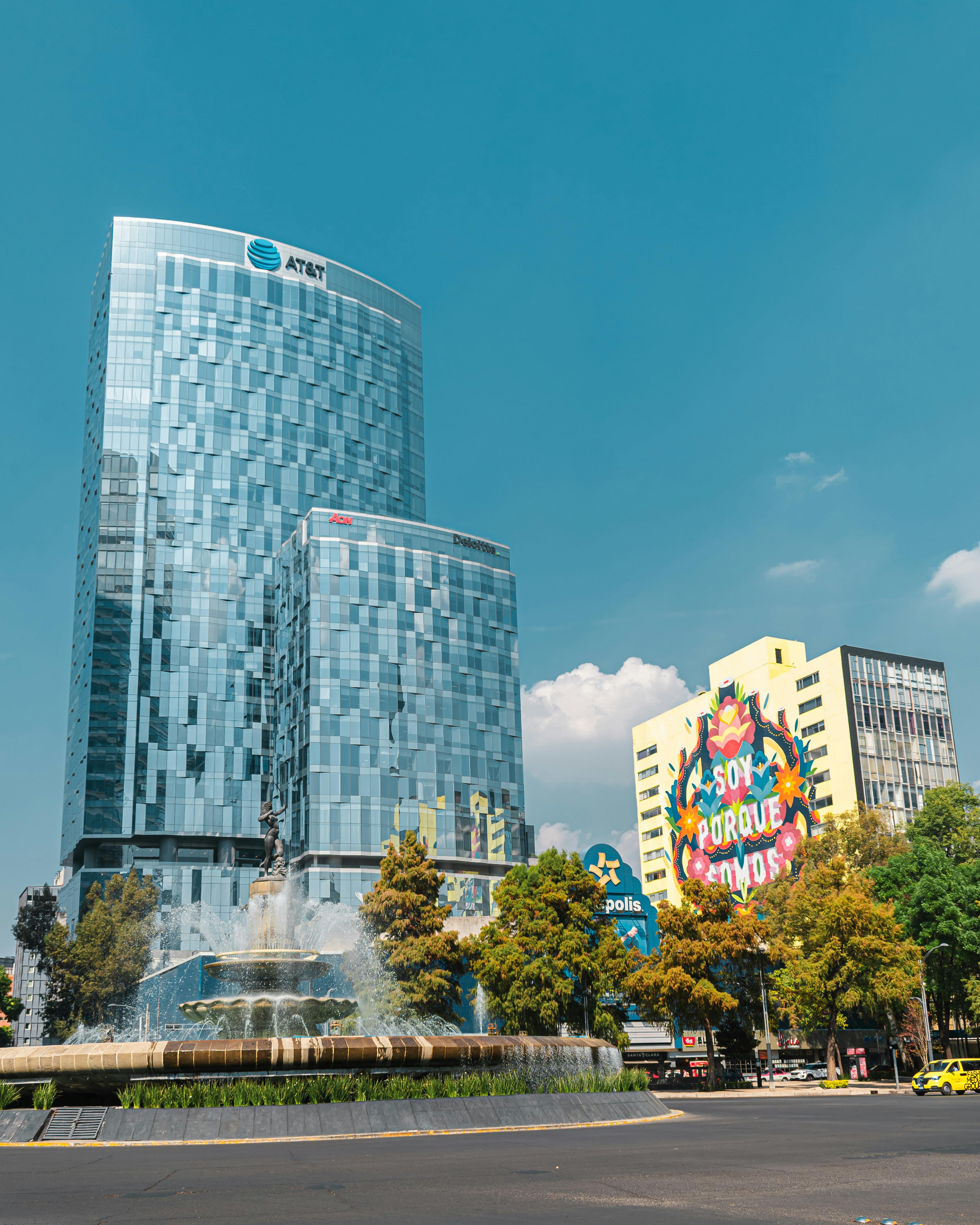 Black Tower Near Fountain Under Blue Sky and White Clouds · Free Stock ...